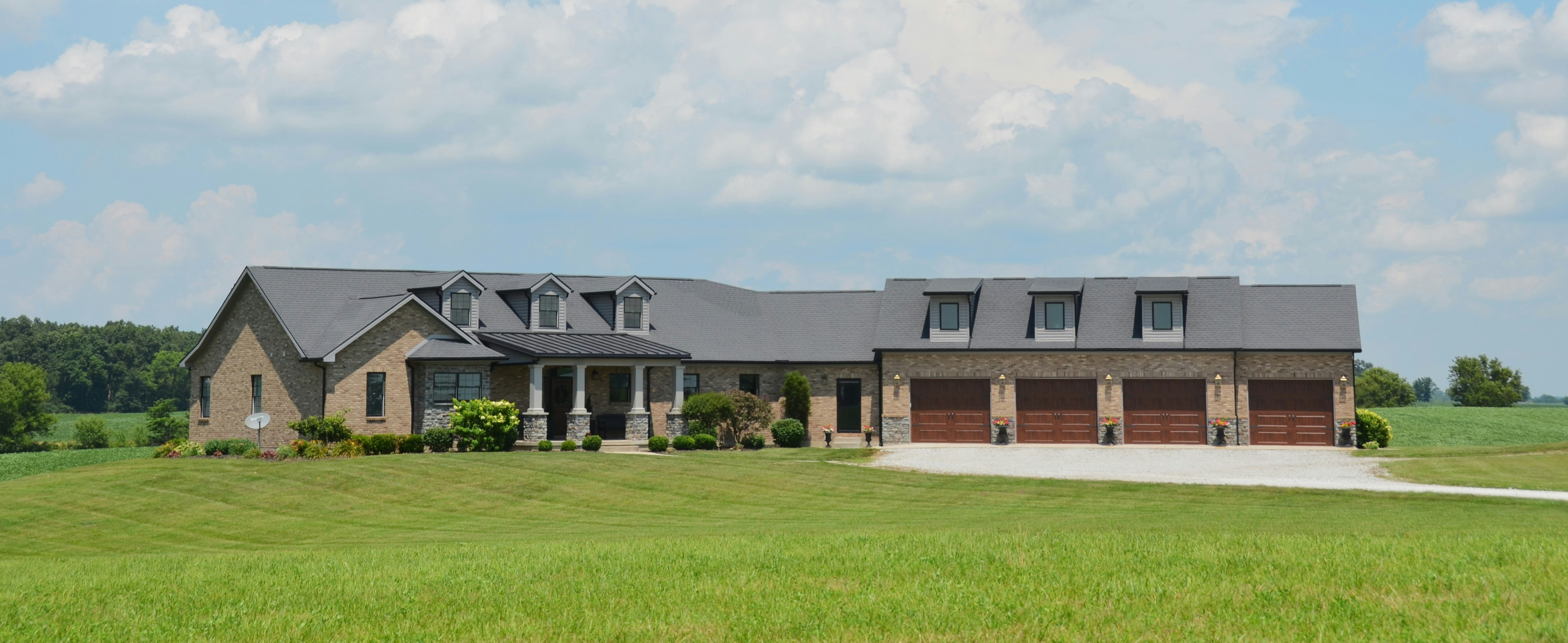 Wide-angle Quiet: A Single‑Story Brick Home with a Three-Car Garage