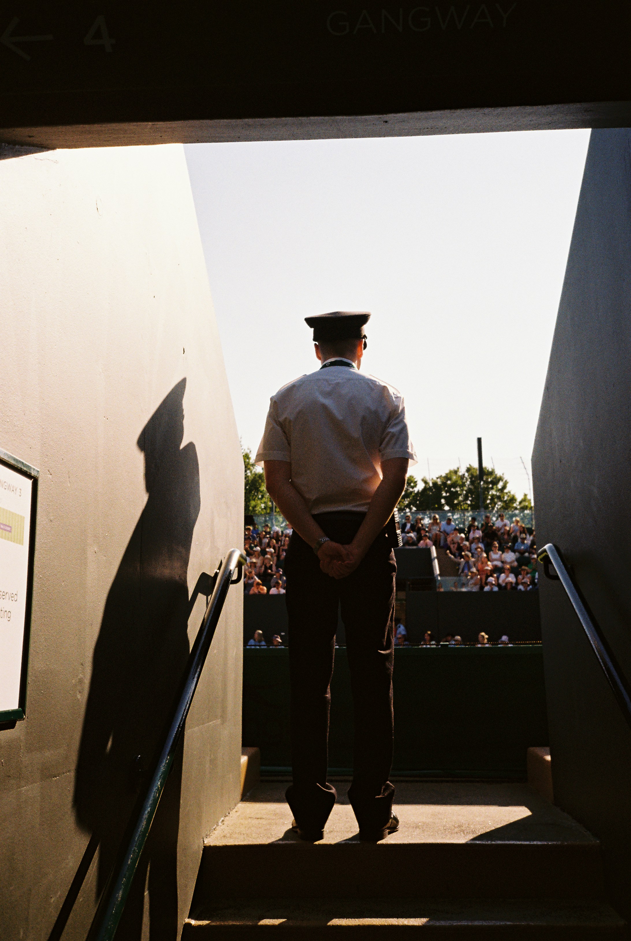 Stalwart at the Exit: A Ceremony's Quiet Moment