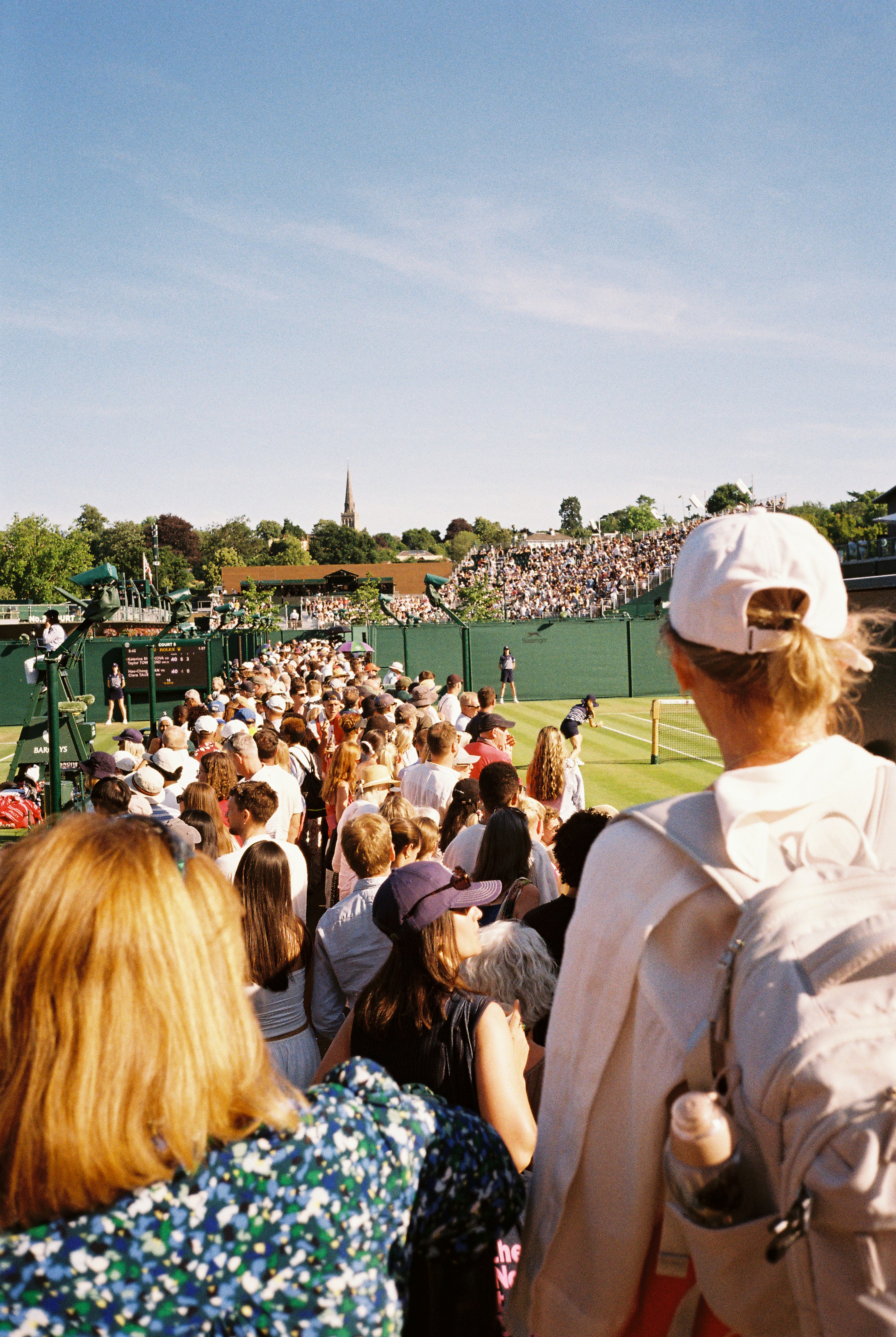 Crowdbound on Center Court: A Sunlit Tennis Day