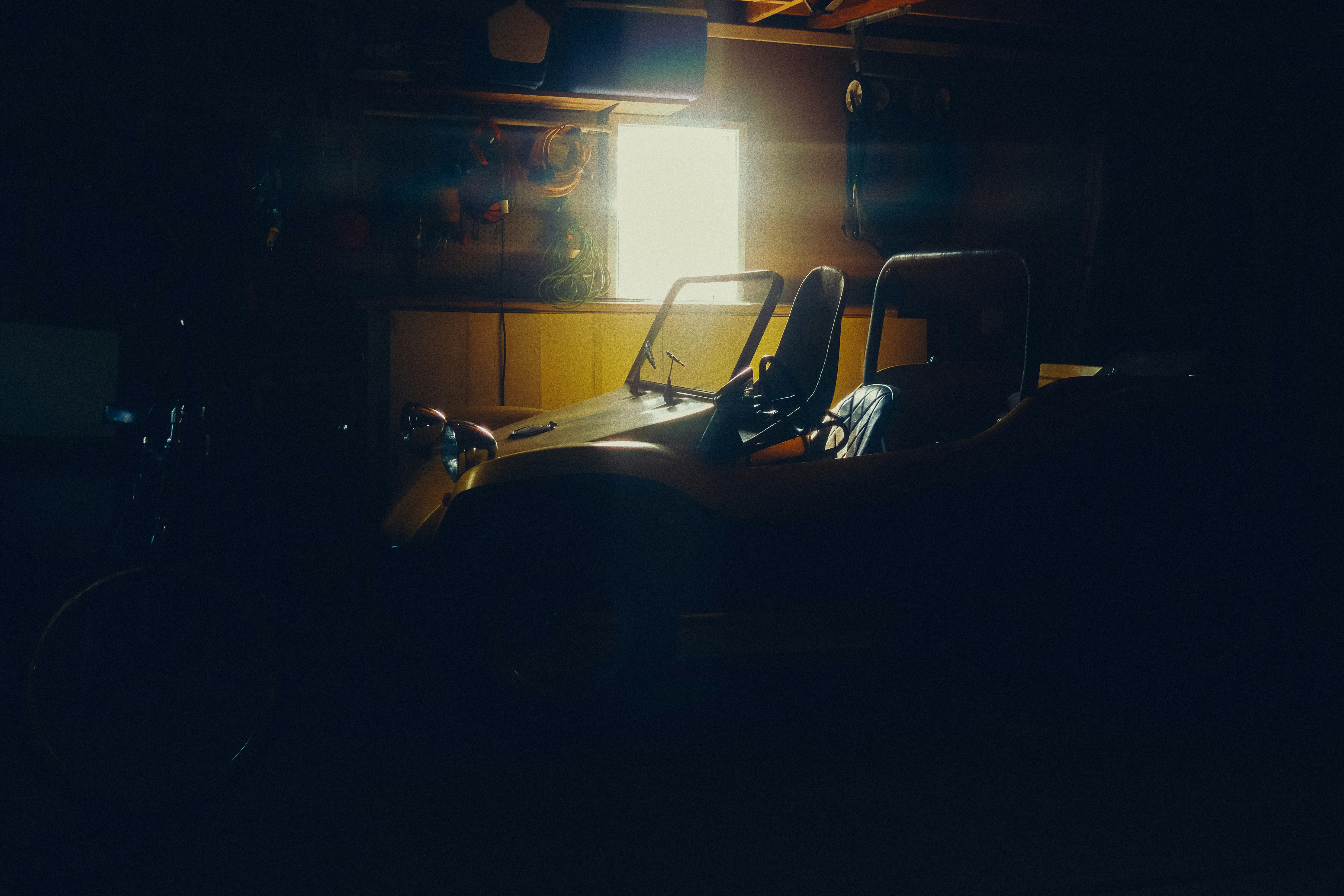 Backlit Vintage Bike Cab: A Glimpse of Quiet Power in a Dark Garage