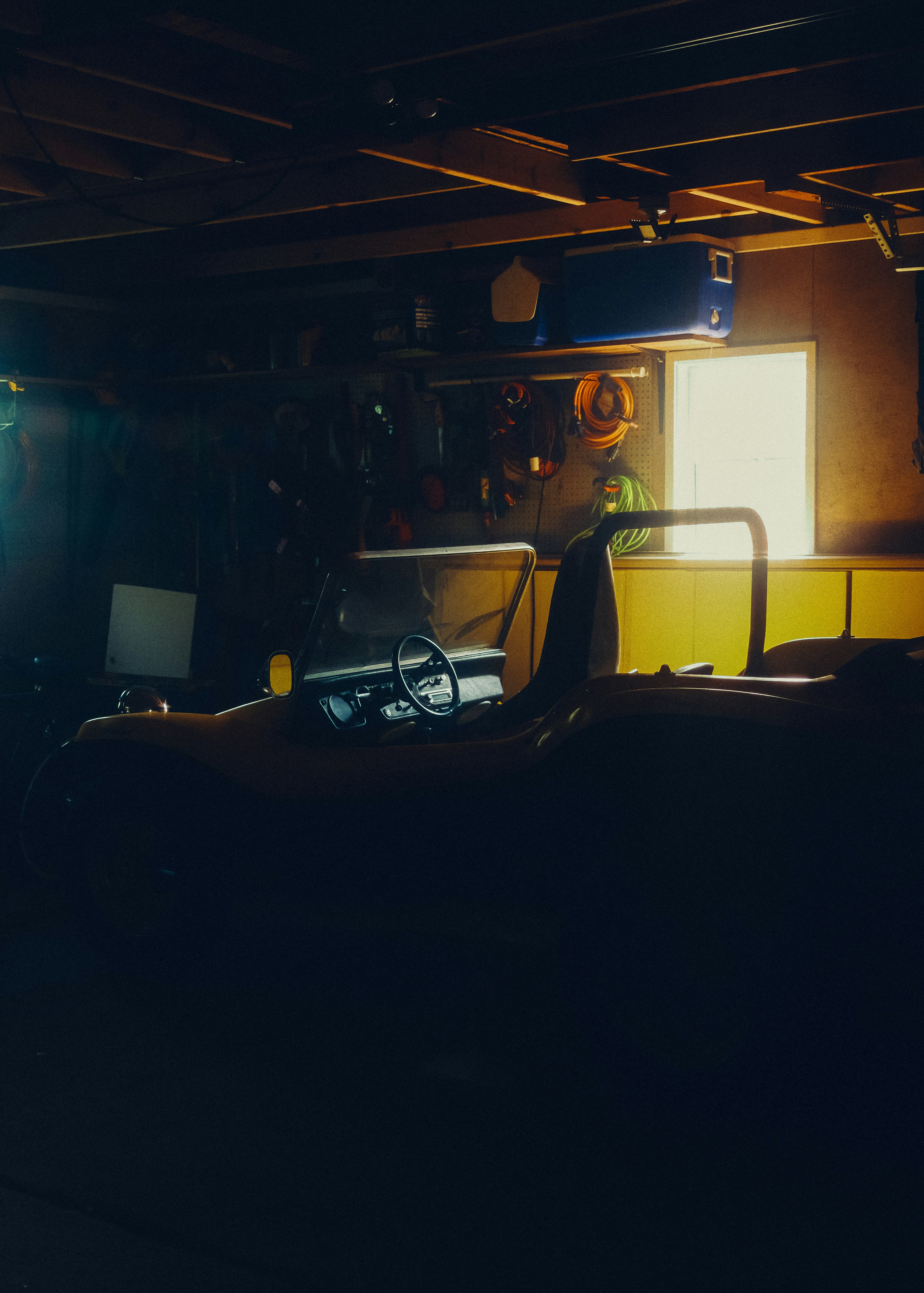Vintage Roadster in a Dimly Lit Garage