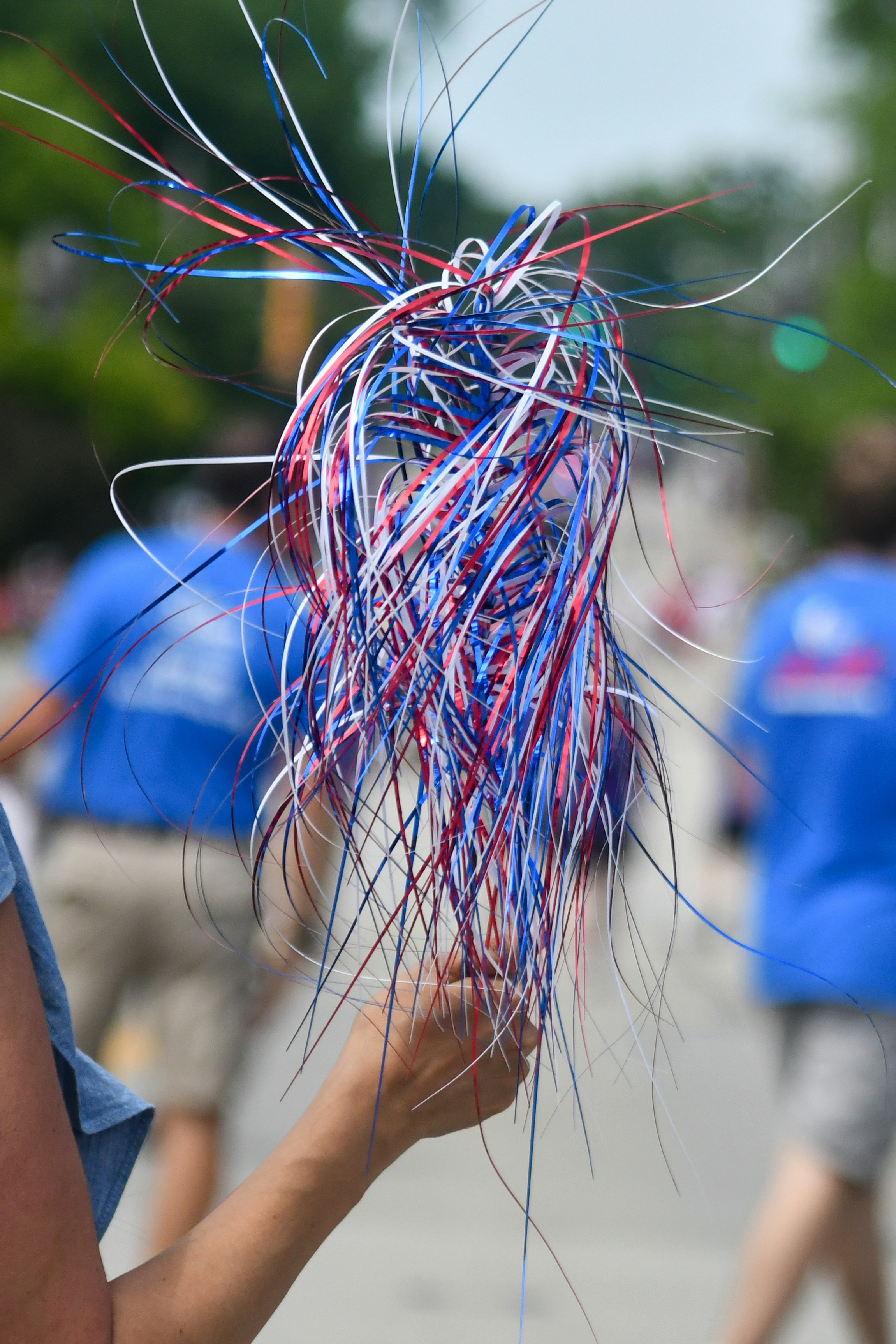 Patriotic Confetti Wand in Motion at a Crowd Run
