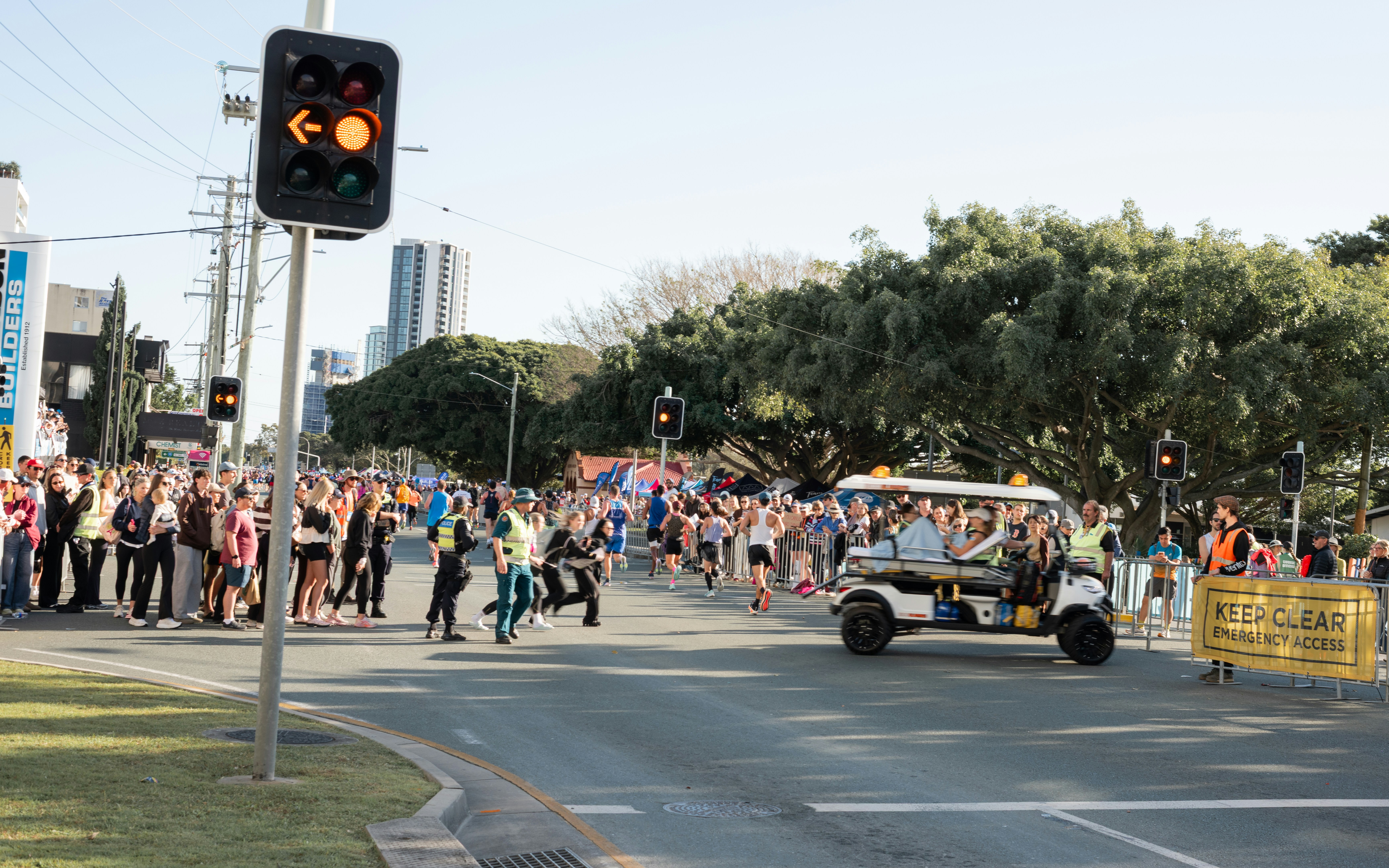Crowd Crossing in the Sunlit Street Scene
