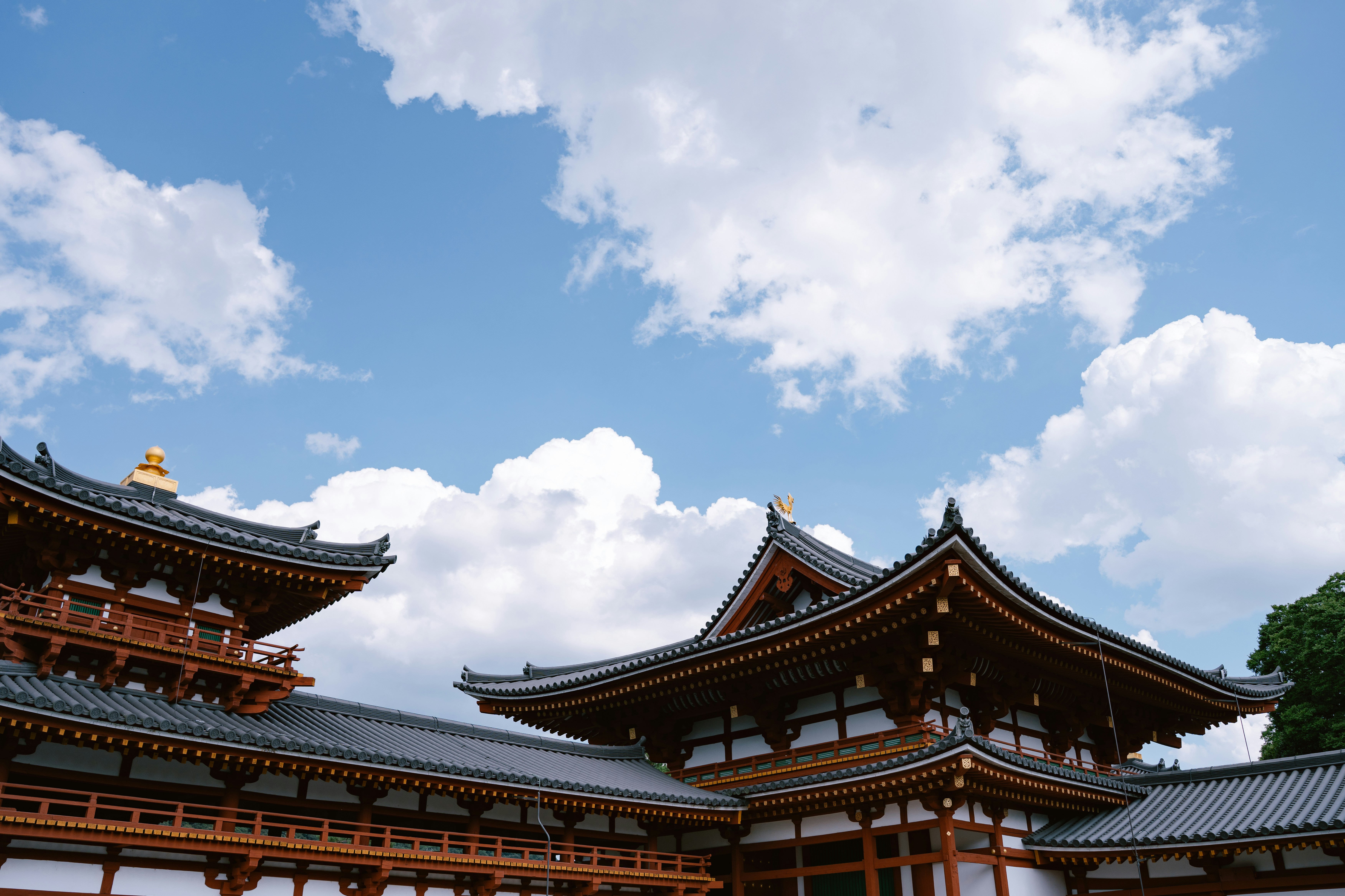 Temple Rooflines Framed Against a Sky of Puffed Clouds
