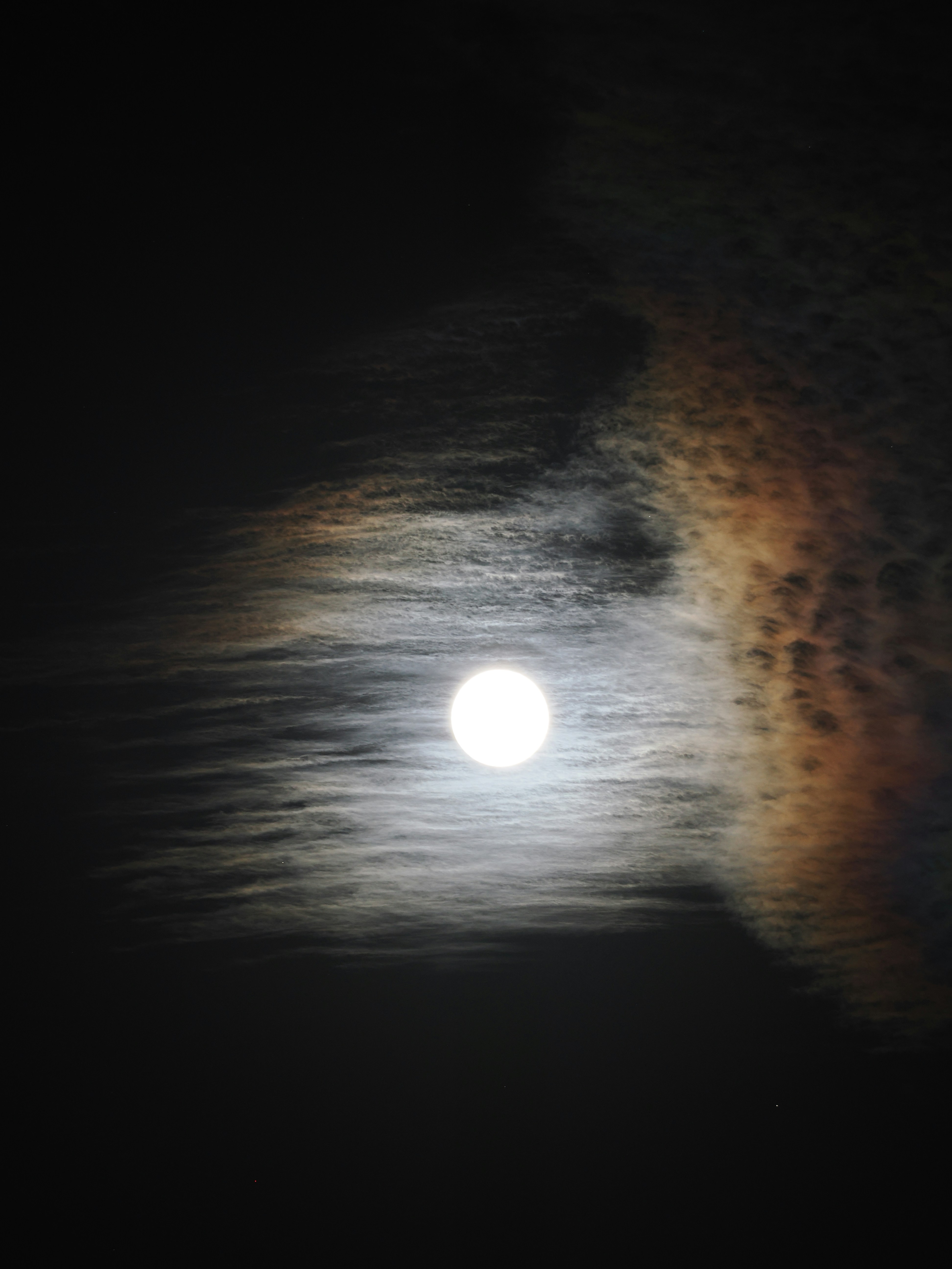 Moonlit Ripple: A Night Sky Painted by Clouds and Water