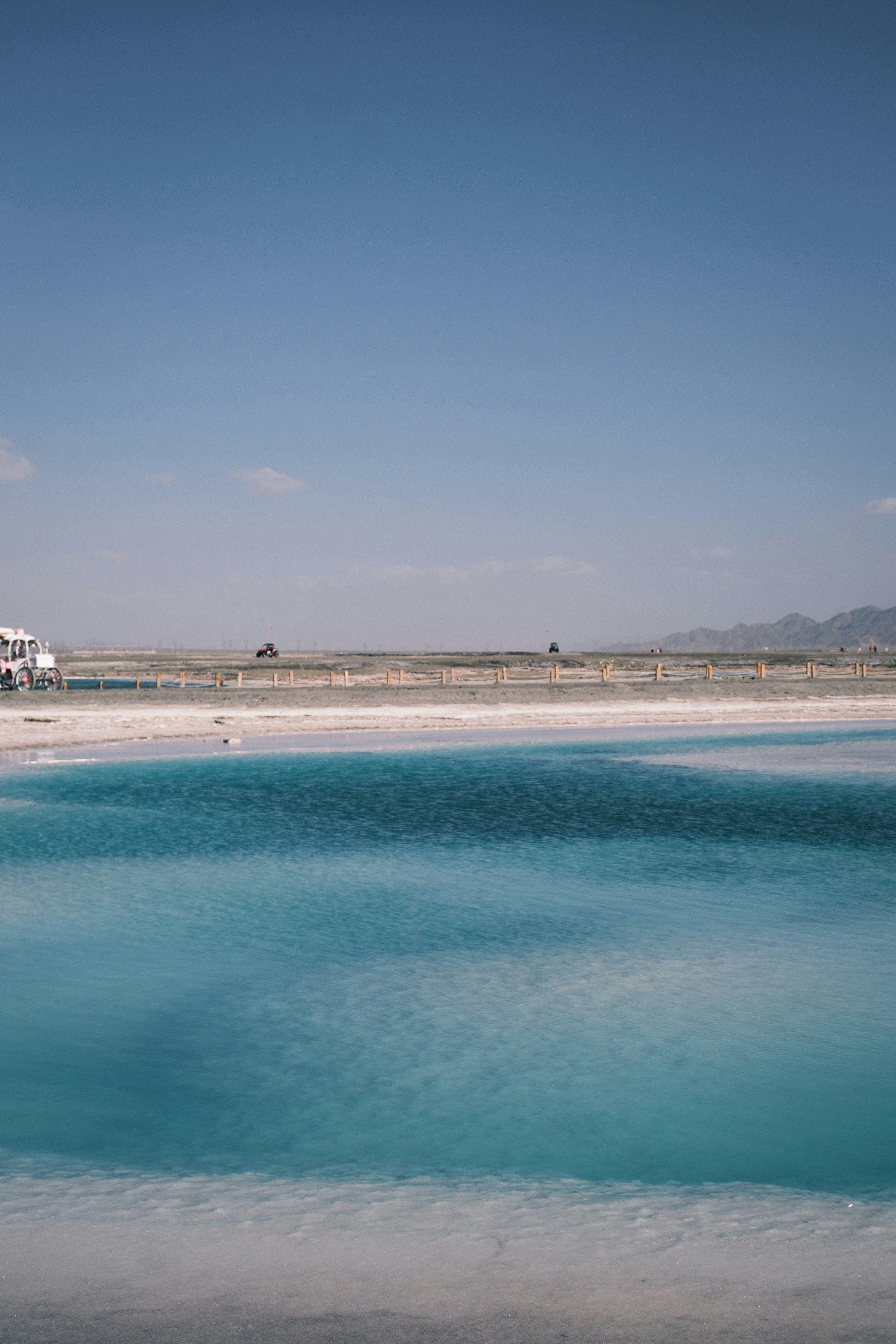 Azure Lagoon with a Distant Dune Road