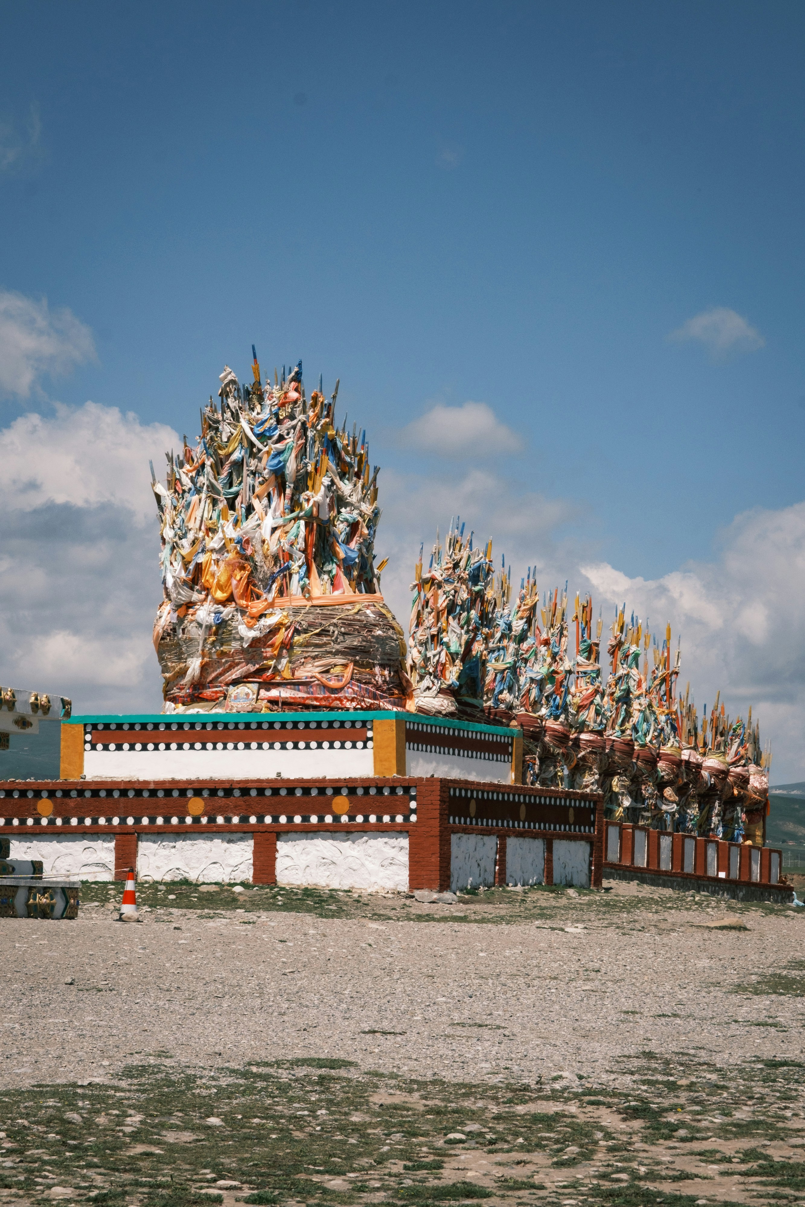 Colorful Dragon-Scaled Stupa Arches under a Clear Sky