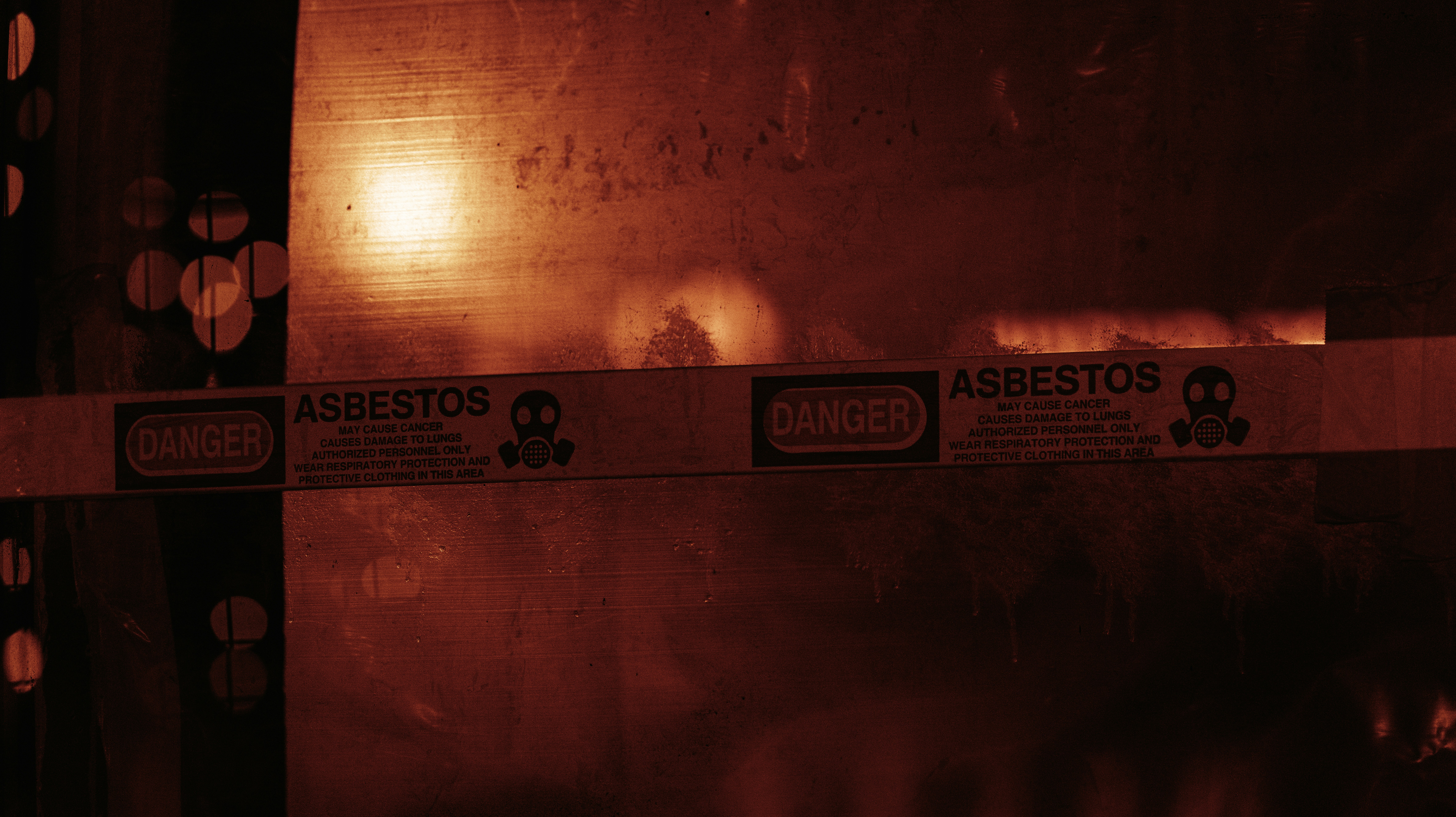 Hazard Tape and Industrial Glow in a Red-tinged Scene
