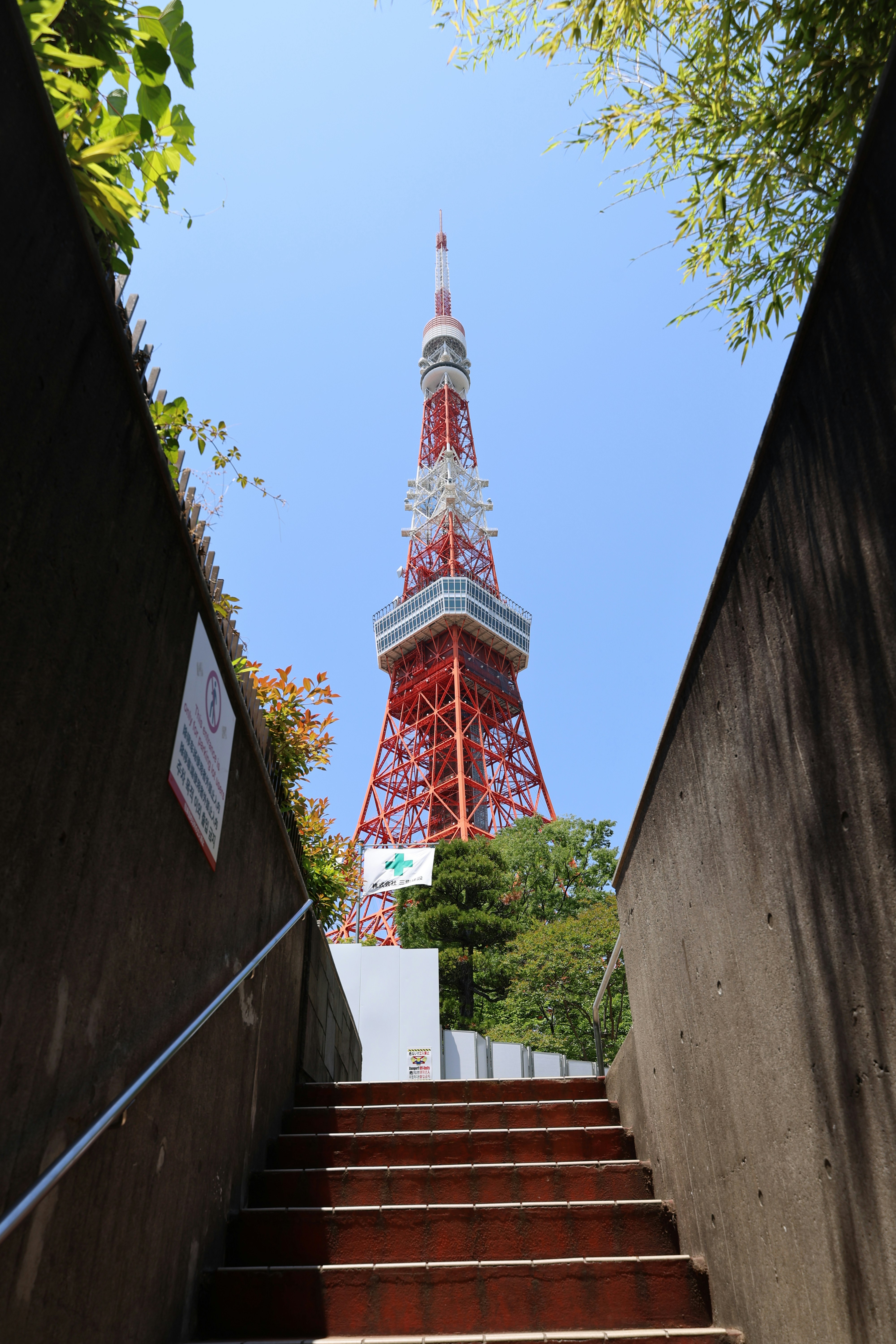 Tower Ascent: Tokyo Bridge Framed by Shadowed Staircase