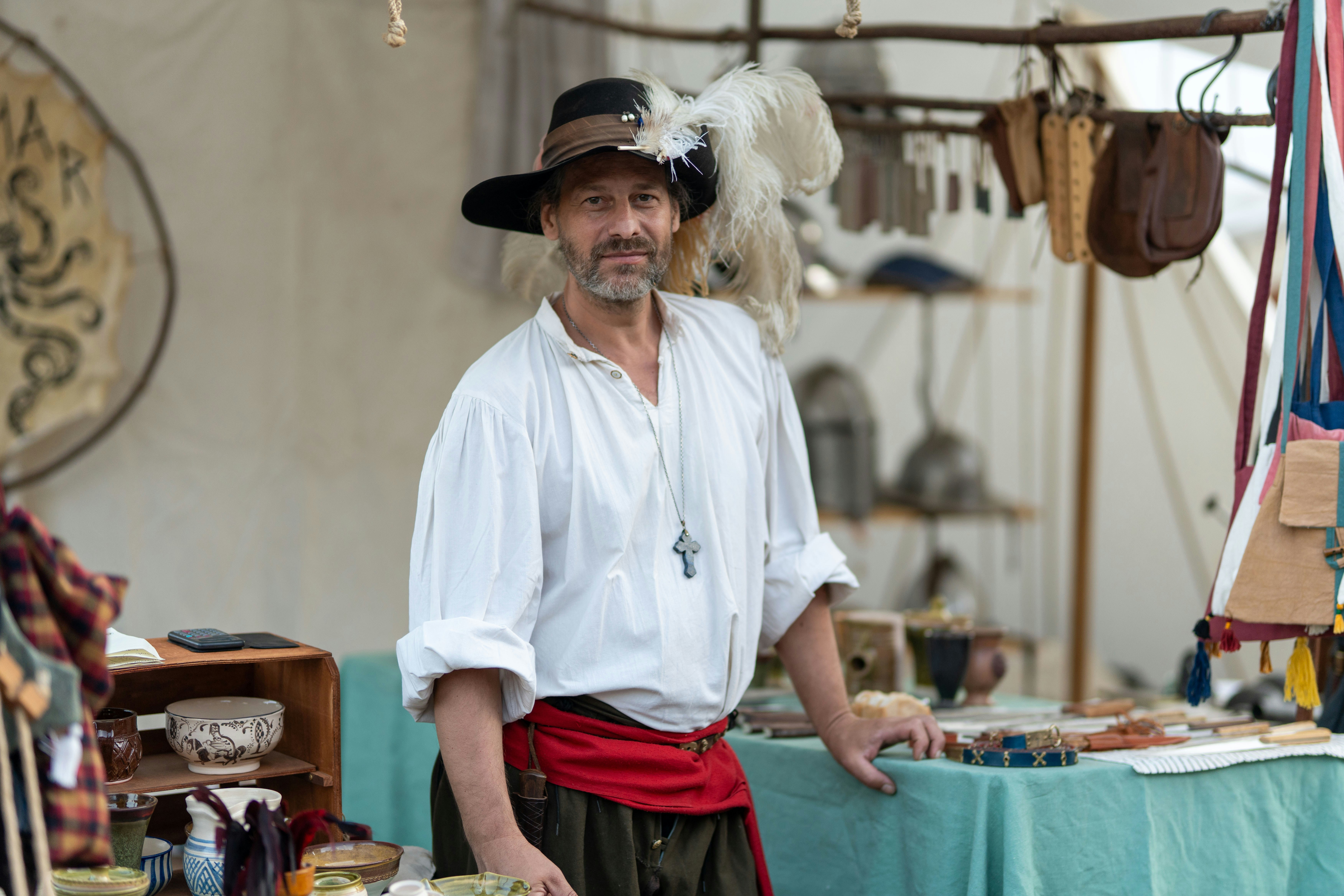 The Gentle Merchant in a Sunlit Market Tent