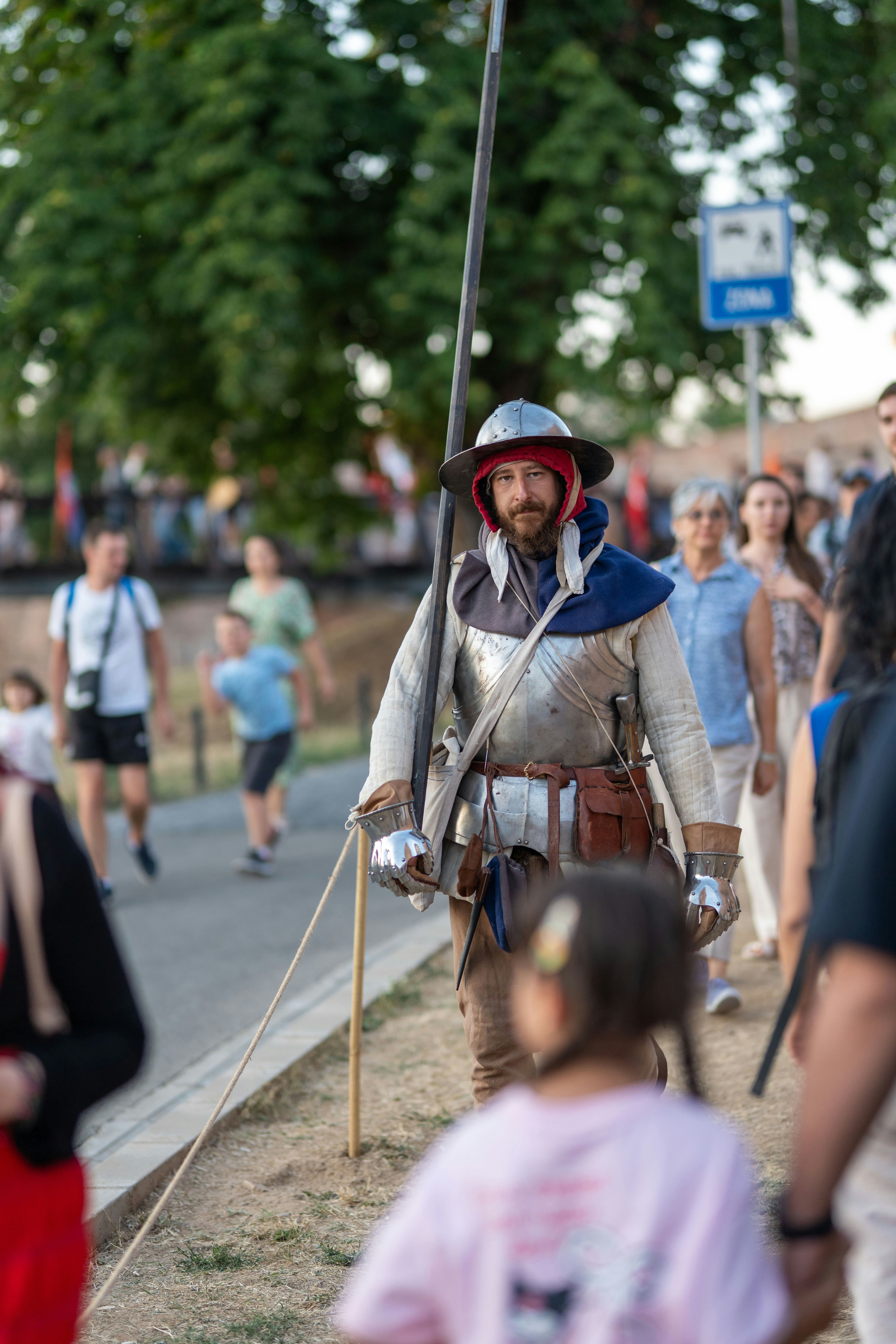 Medieval Knight Walks a Modern Street: A Quiet Hero among the Crowd