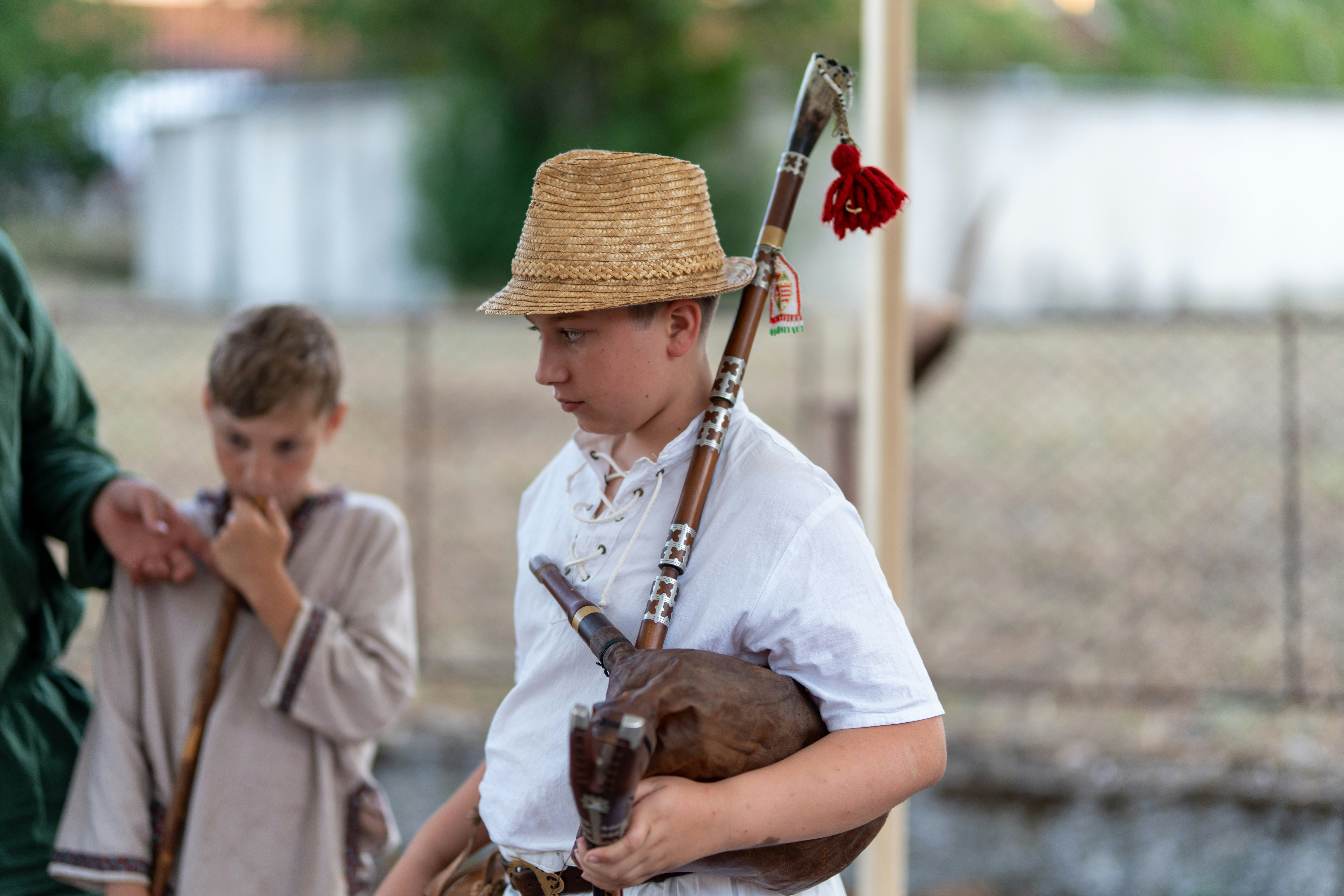 Tin Soldier with Bagpipe: A Quiet Moment in a Fenced Backyard