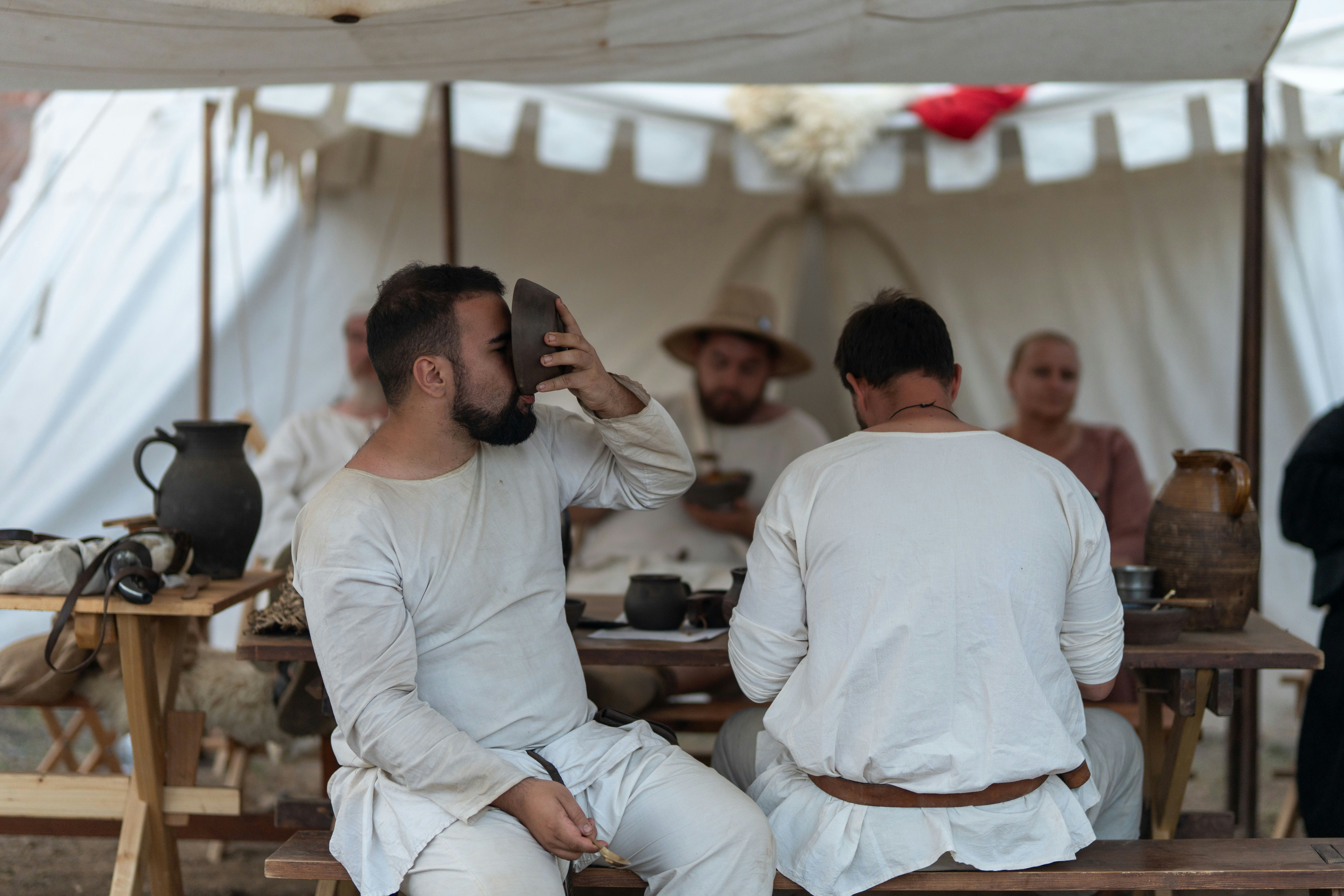 Hands, Beard, and a Moment of Camaraderie under Canvas
