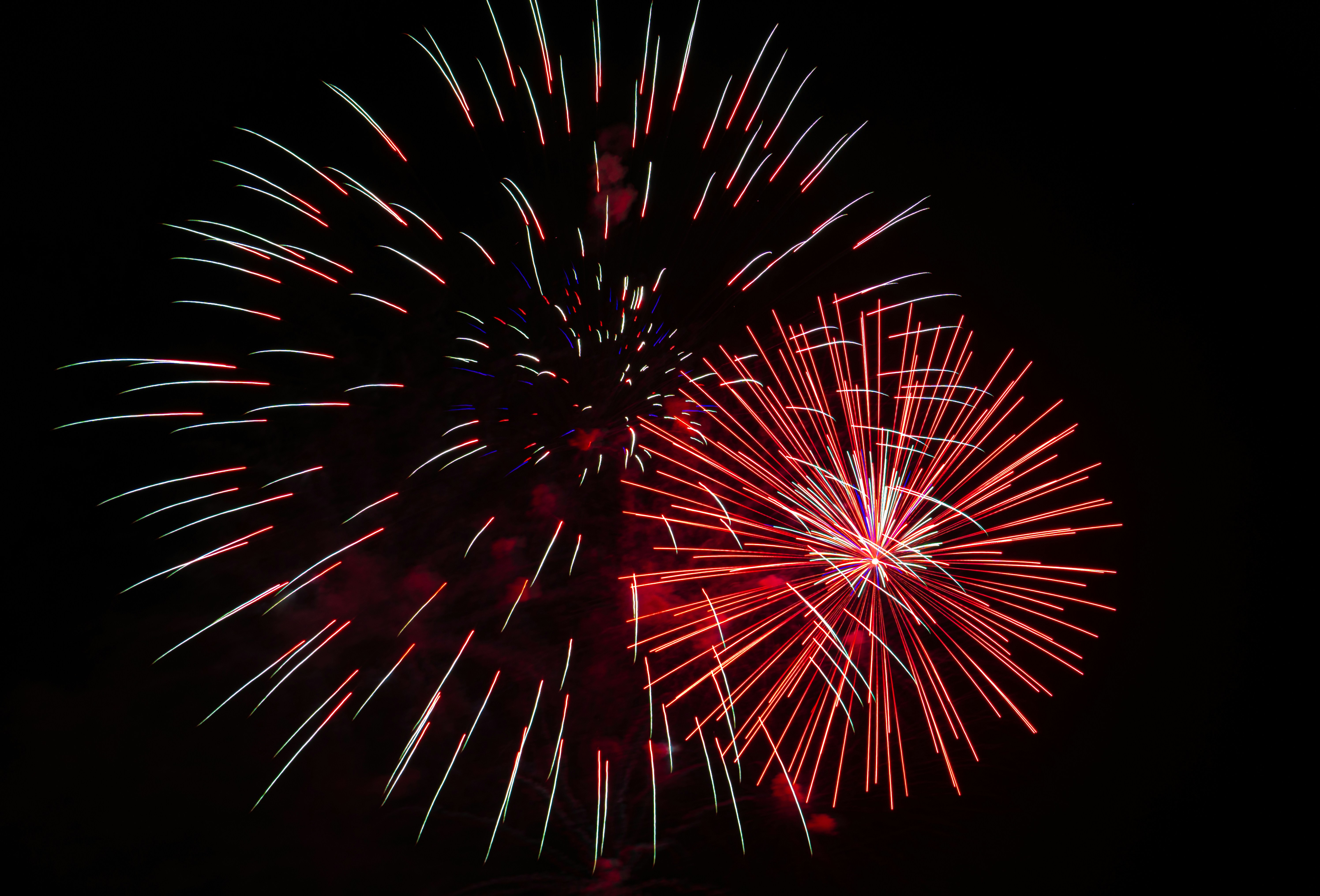 Twin Fireworks Over a Dark Sky: Hue and Burst