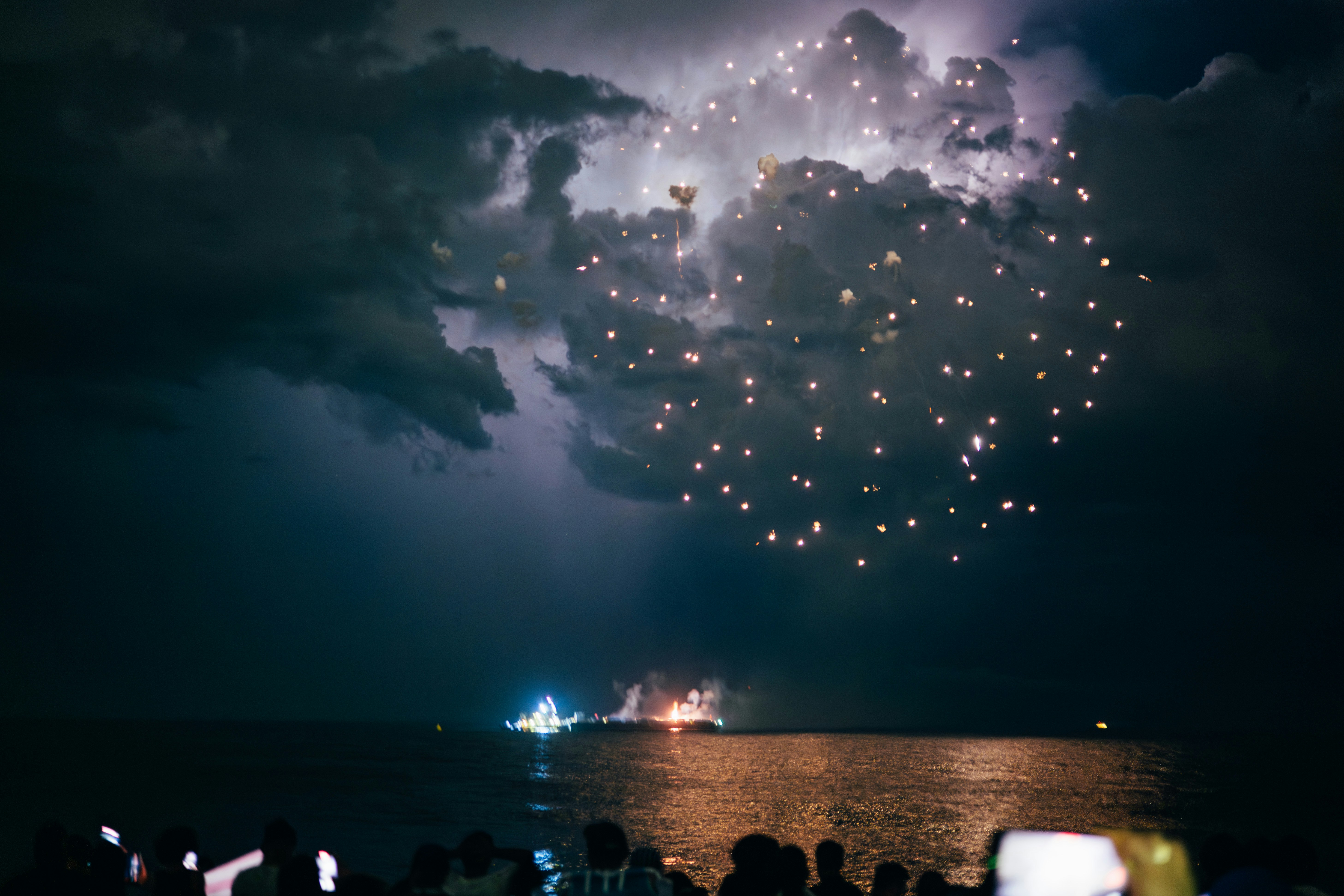 Midnight Burst: Fireworks Over a Quiet Sea