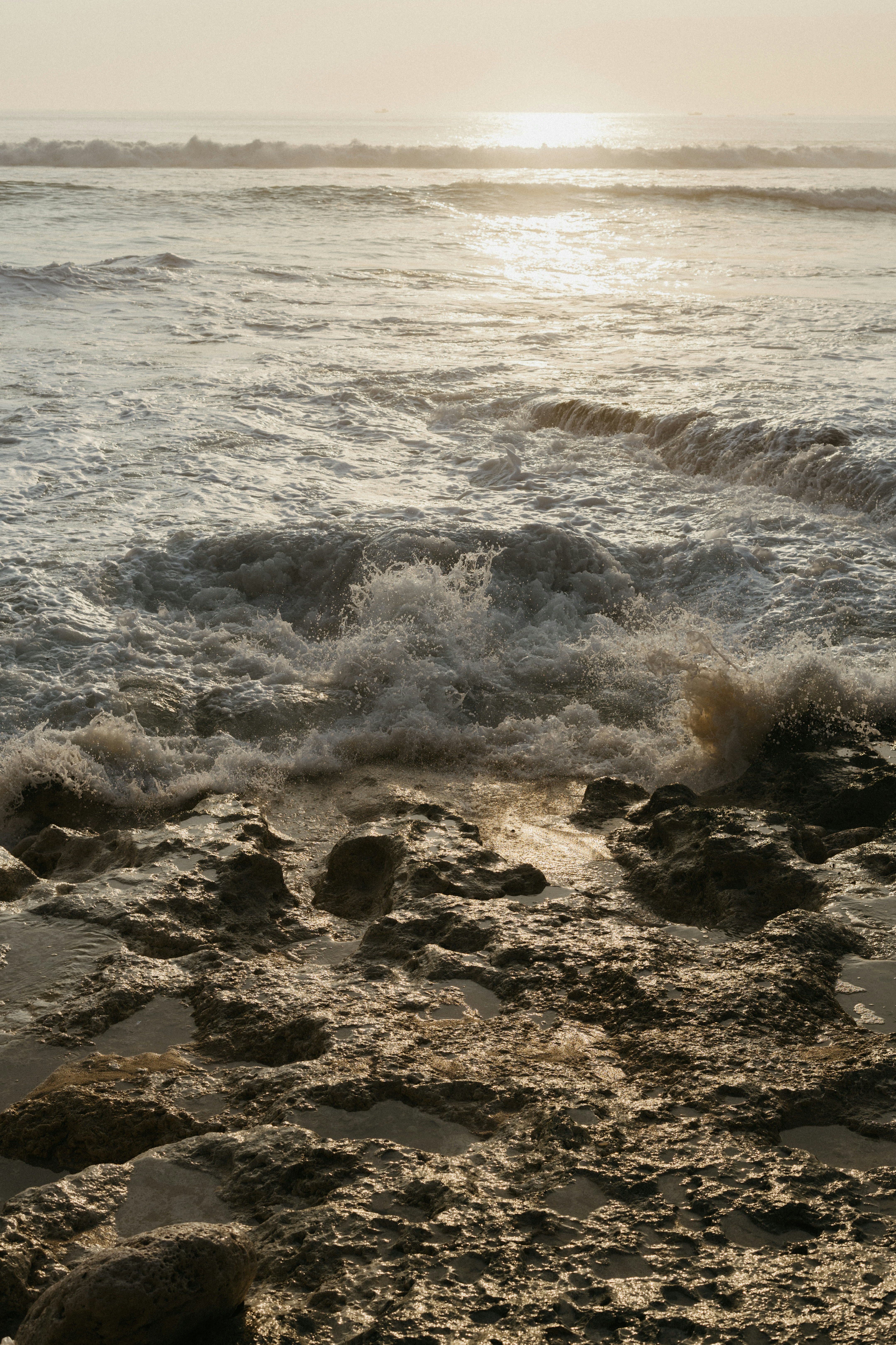 Golden Hour Over Tidal Rocks at the Shore