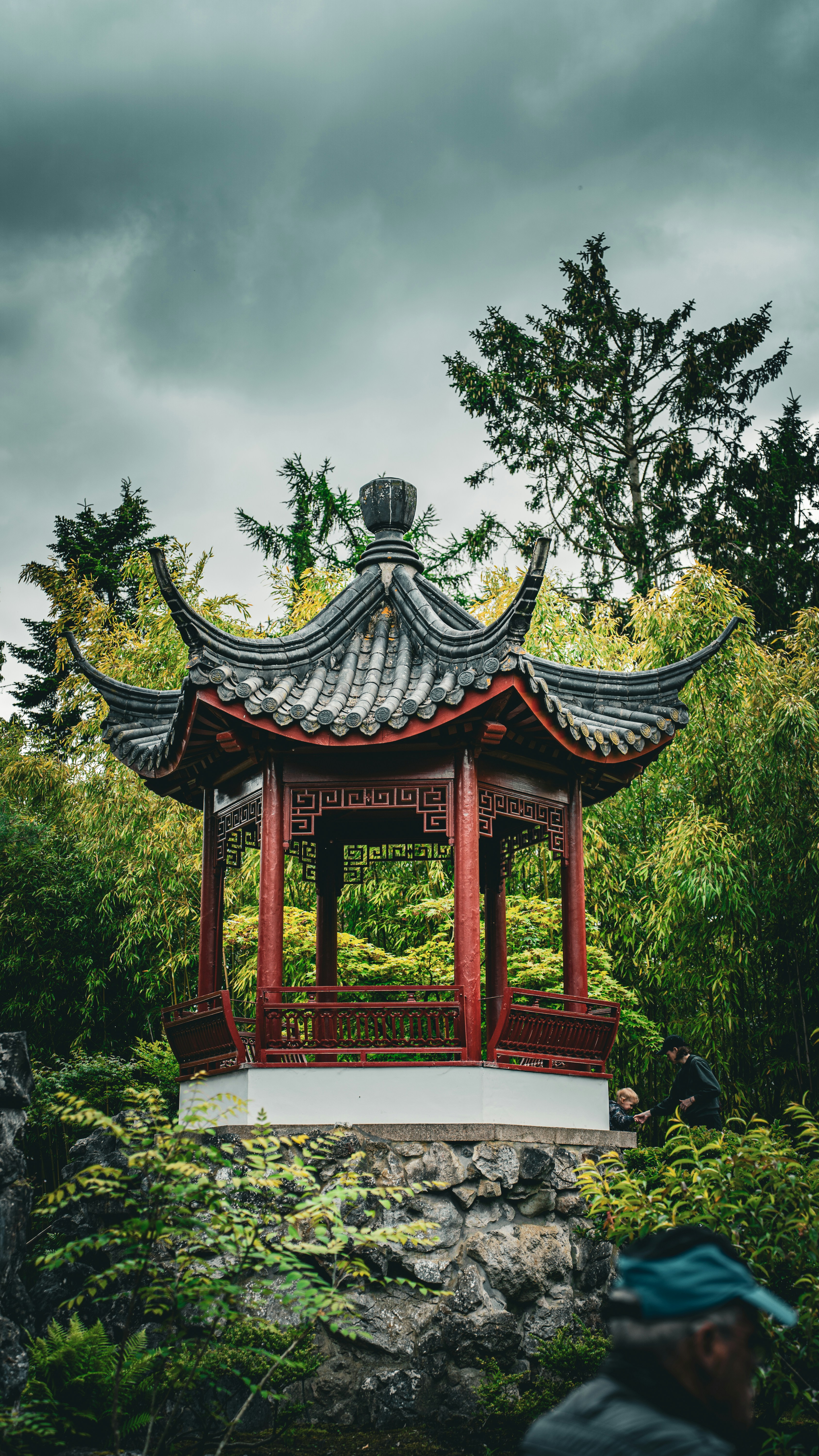 Red Pavilion Amid Greenery: A Quiet Moment in the Garden