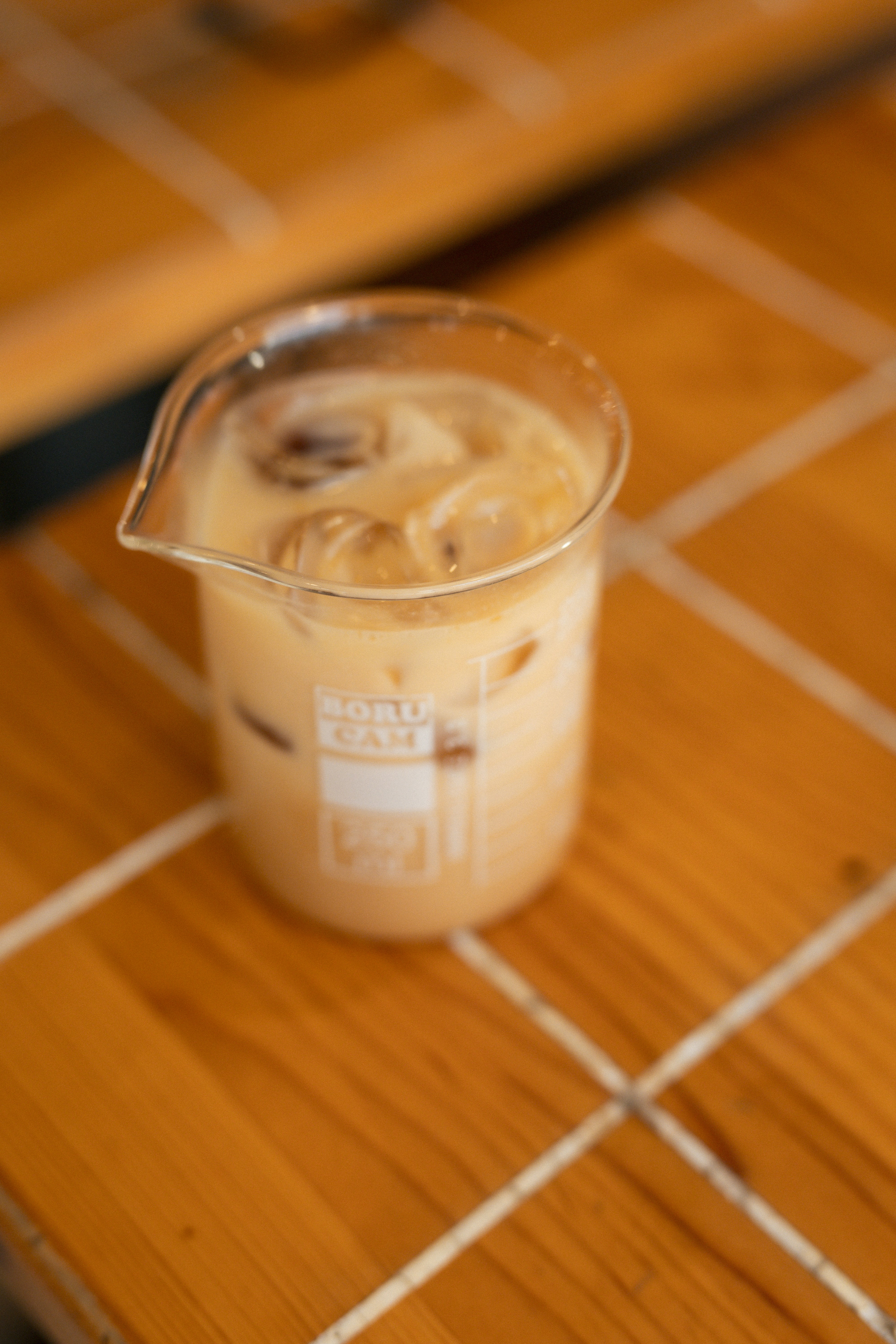 Iced Coffee on a Lined Wooden Table