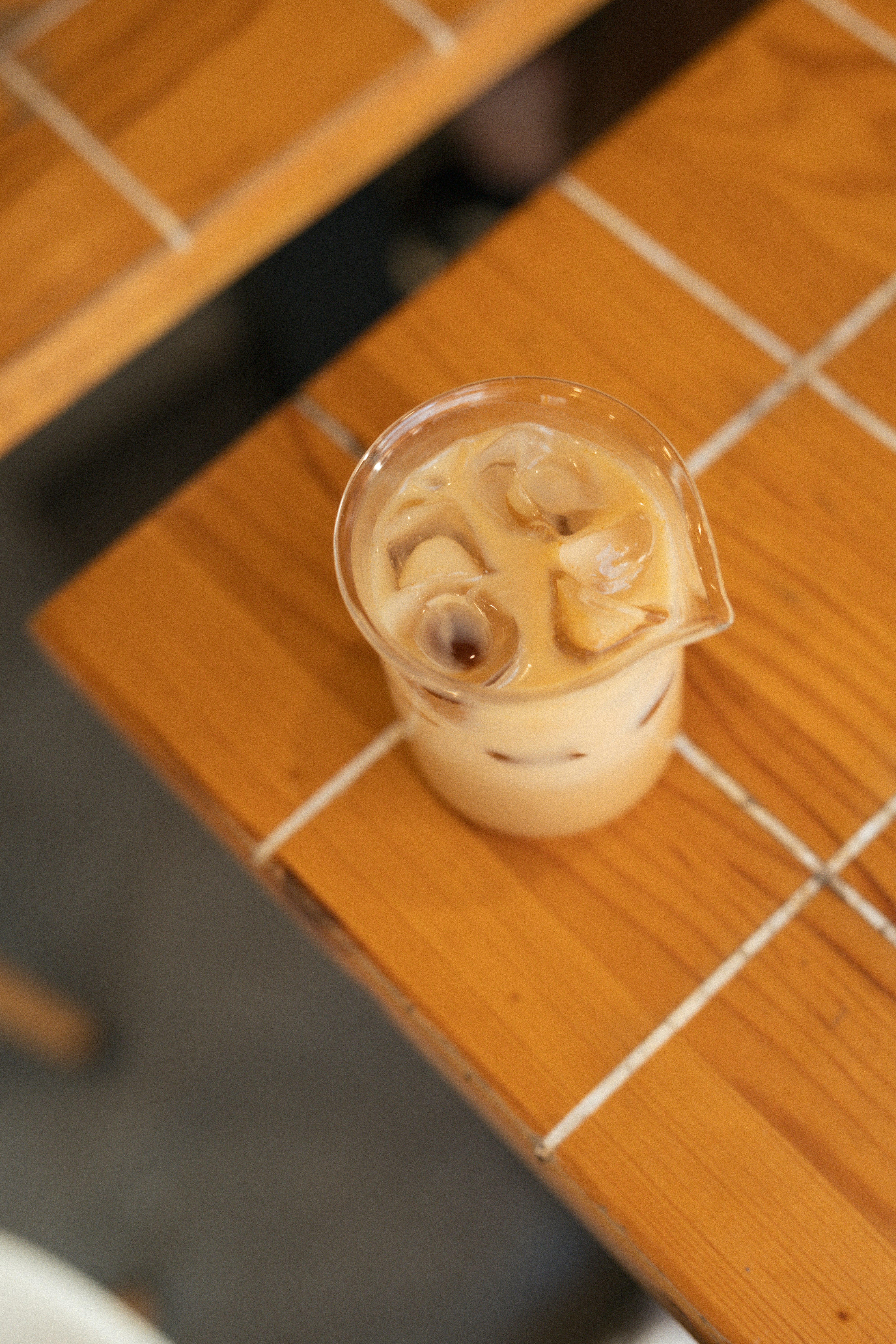 Ice Coffee on a Tiled Edge
