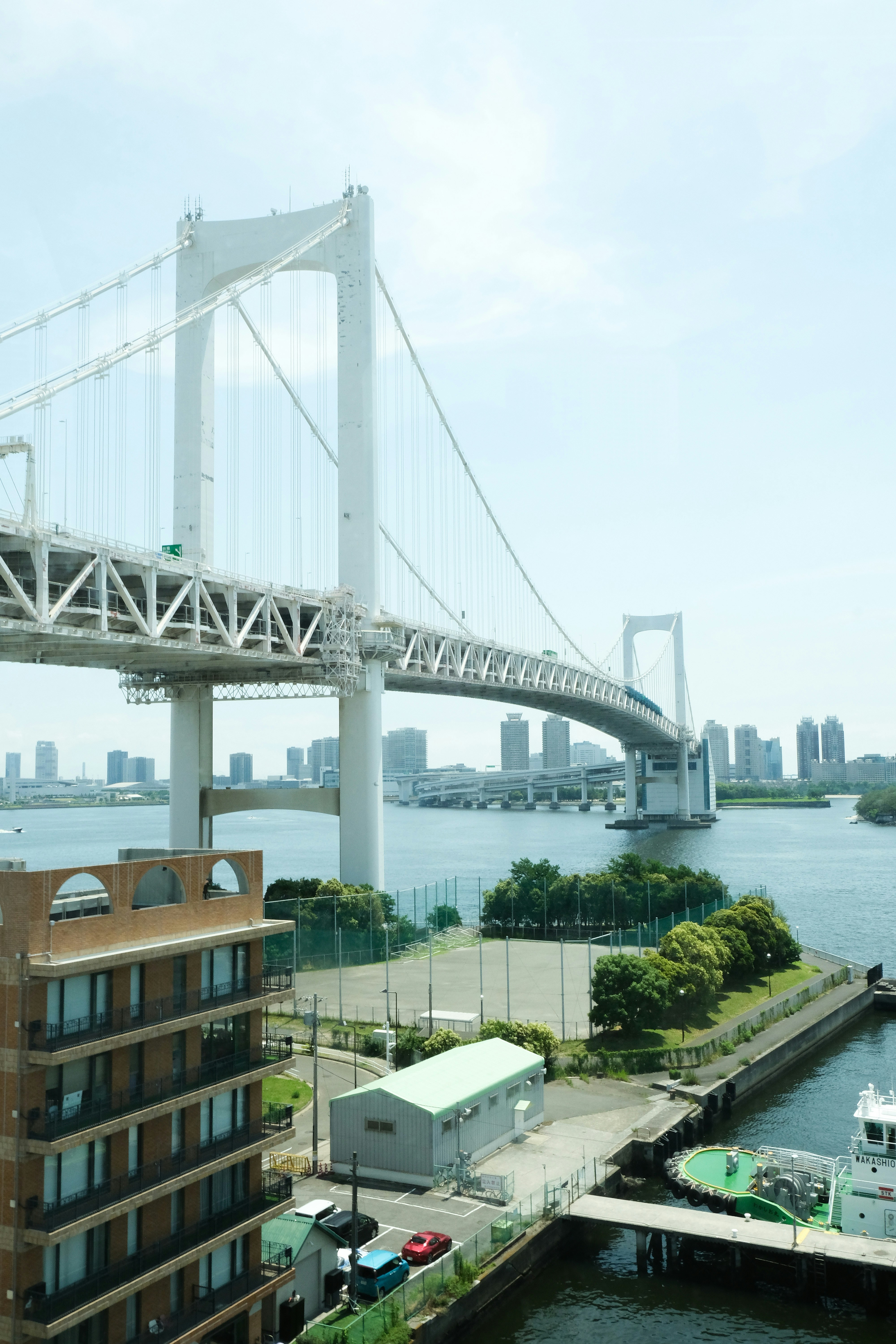 Skyward Span: A City-Facing Bridge Over Calm Waters