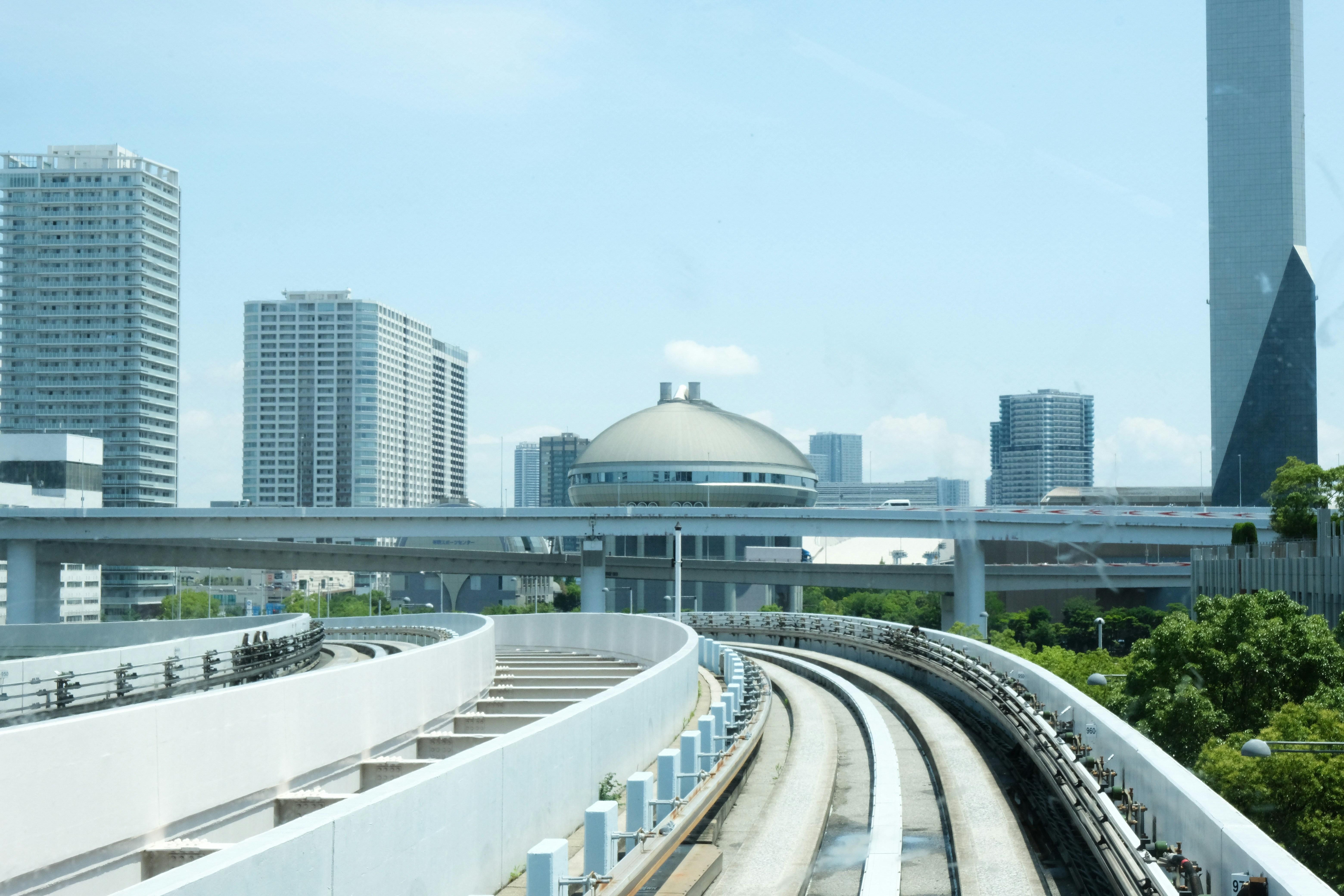 Curved Skyway Over a Modern Harbor City