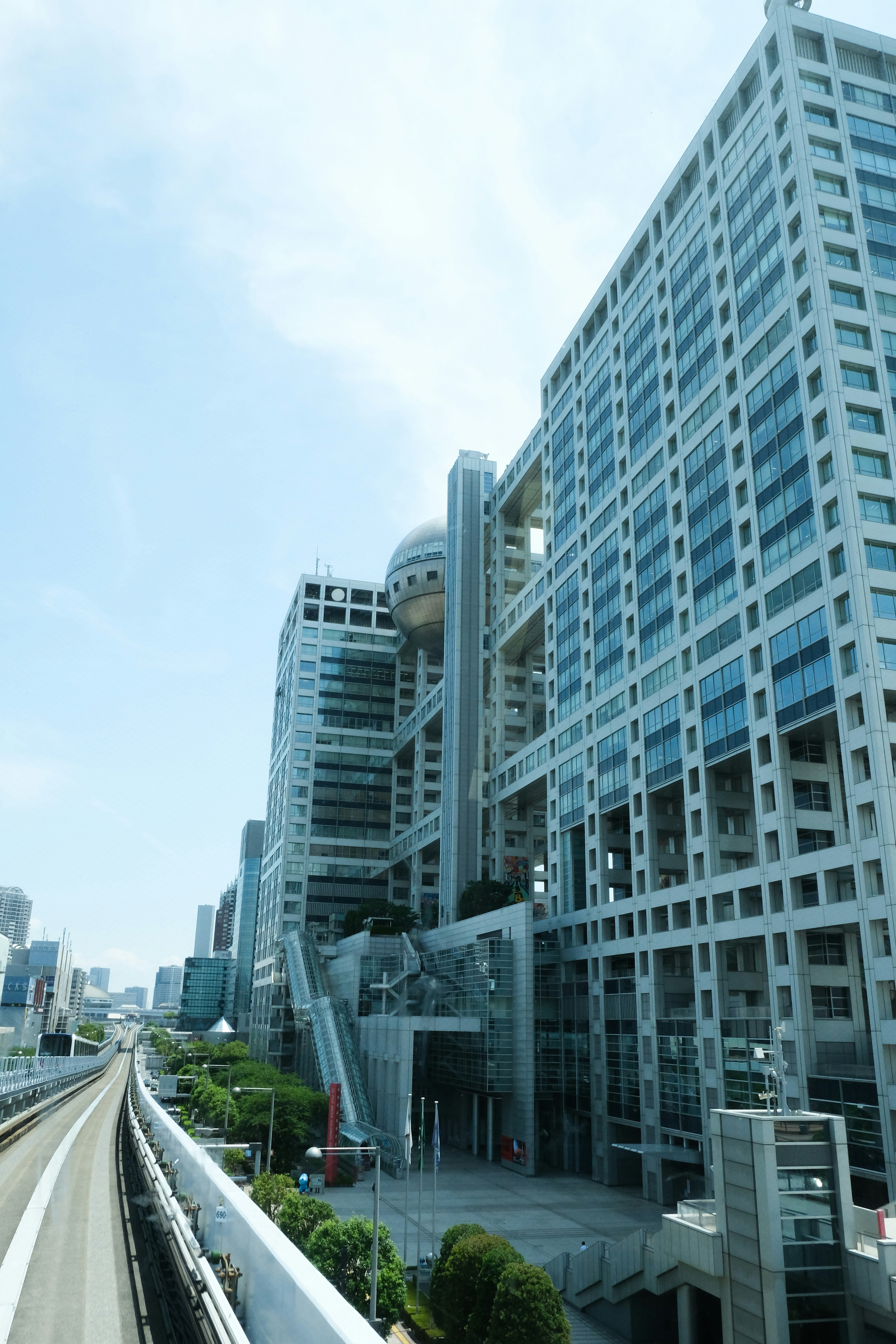 Skybound Geometry: A Towering Corridor of Glass and Rail