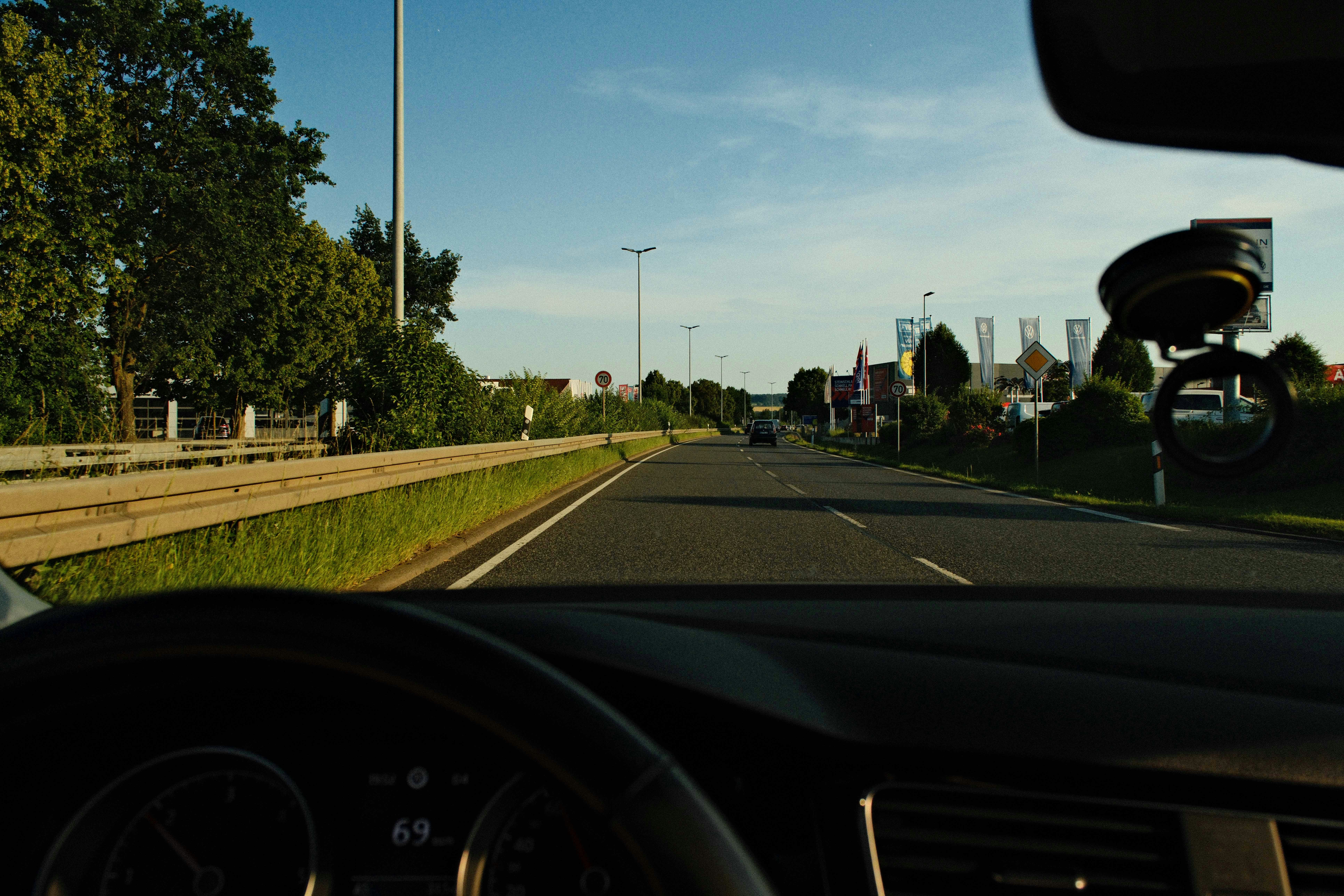 Dashboard View: Open Road Ahead from a Car Cabin