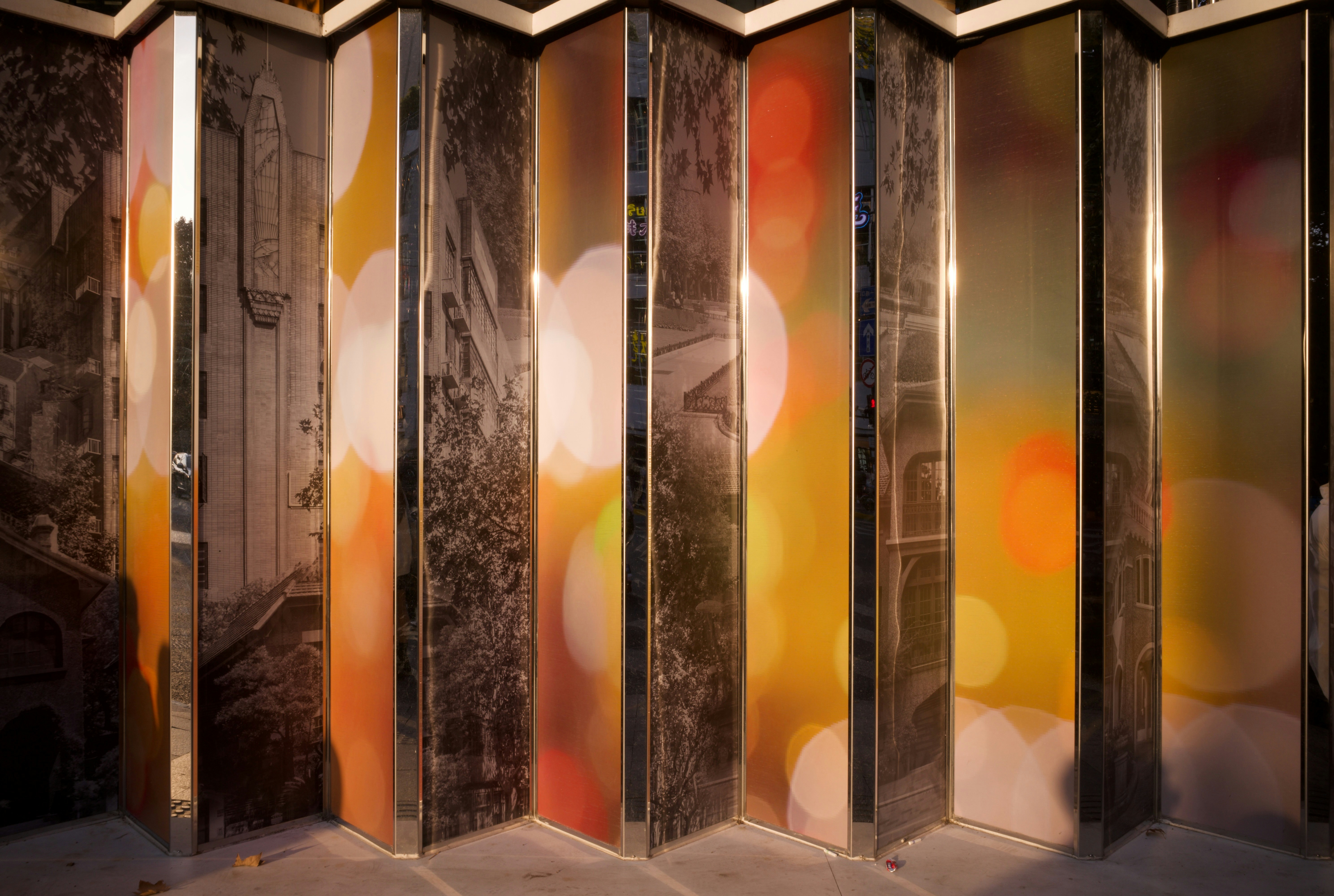 Chromatic Panels: Glowing Orbs Behind Vertical Facades