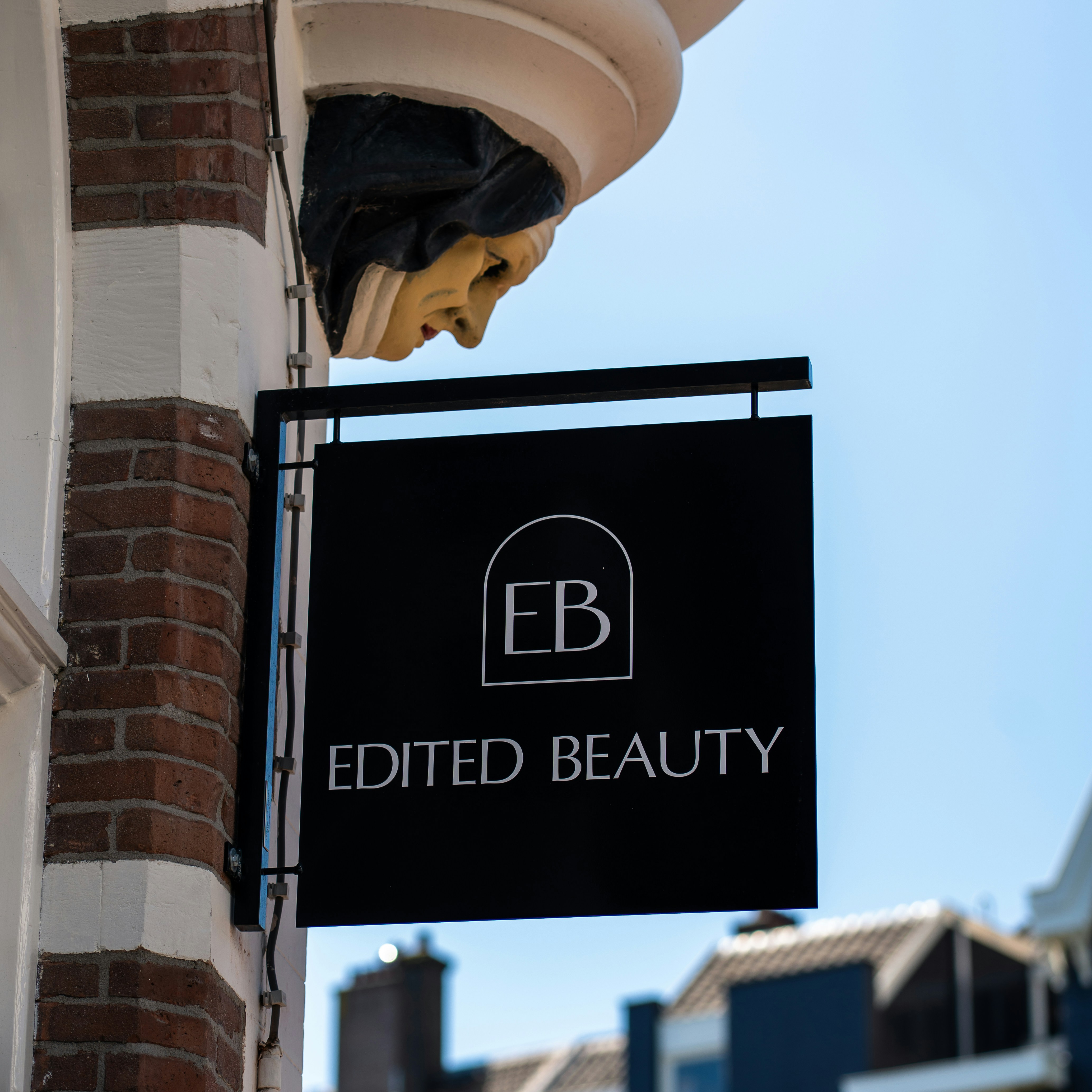 Banner in the Shade: The EB Edited Beauty Sign on a City Corner