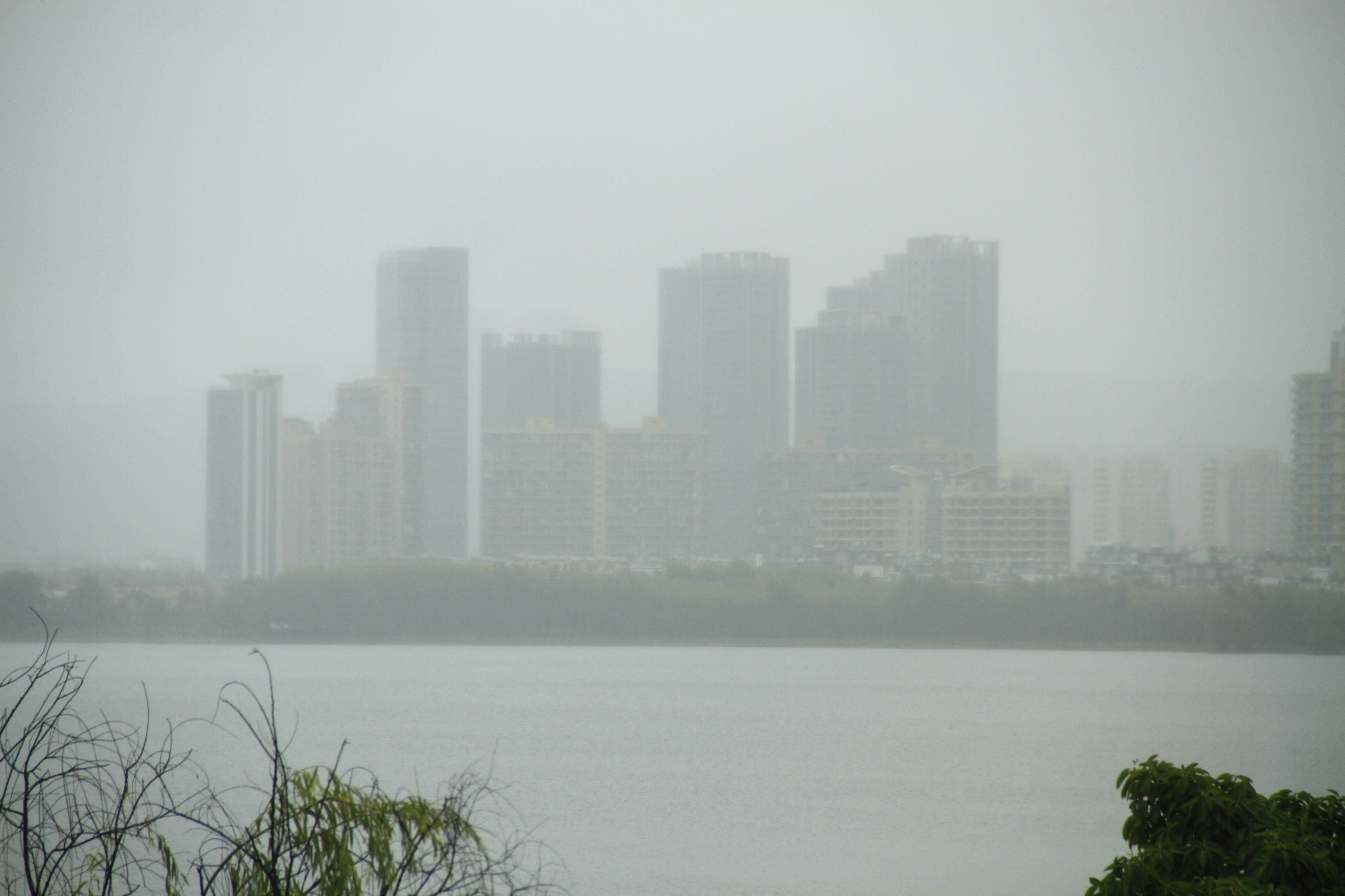 Mist over the Riverfront: Quiet Skyline in Soft Haze