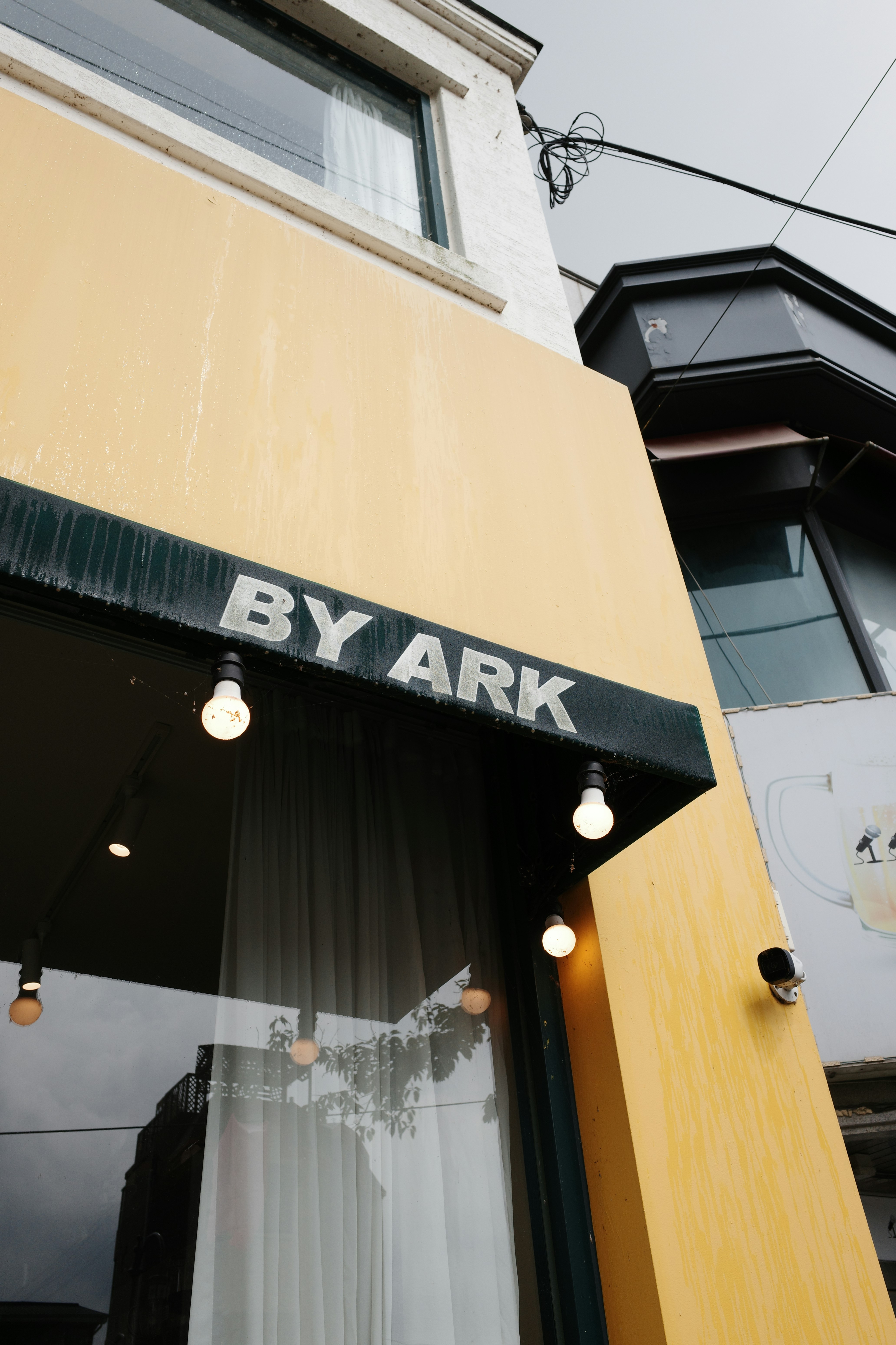 Yellow Facade and Arrow of Lights: BY ARK Exterior