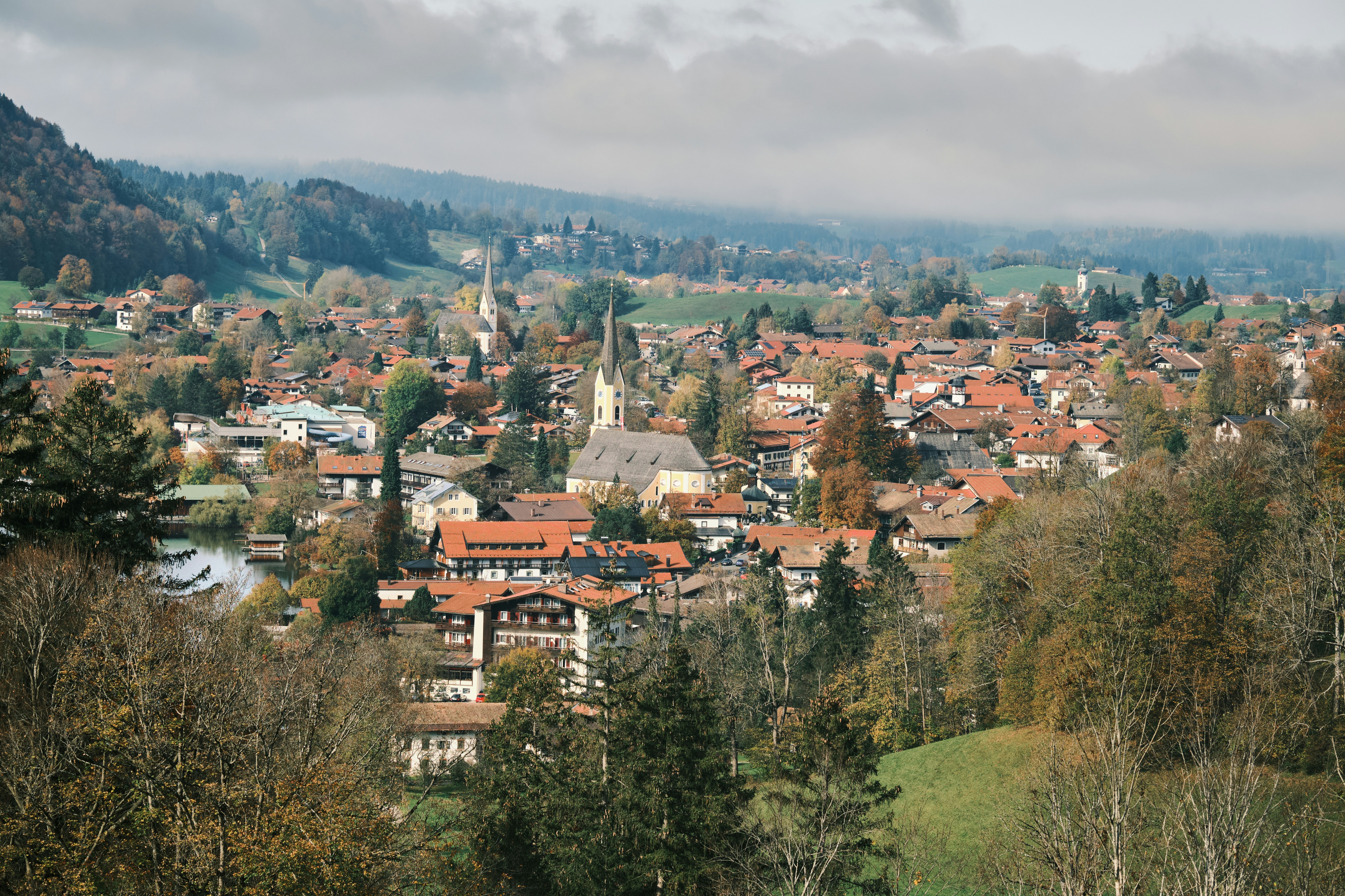 Pastoral Village Spire Amid Rolling Hills