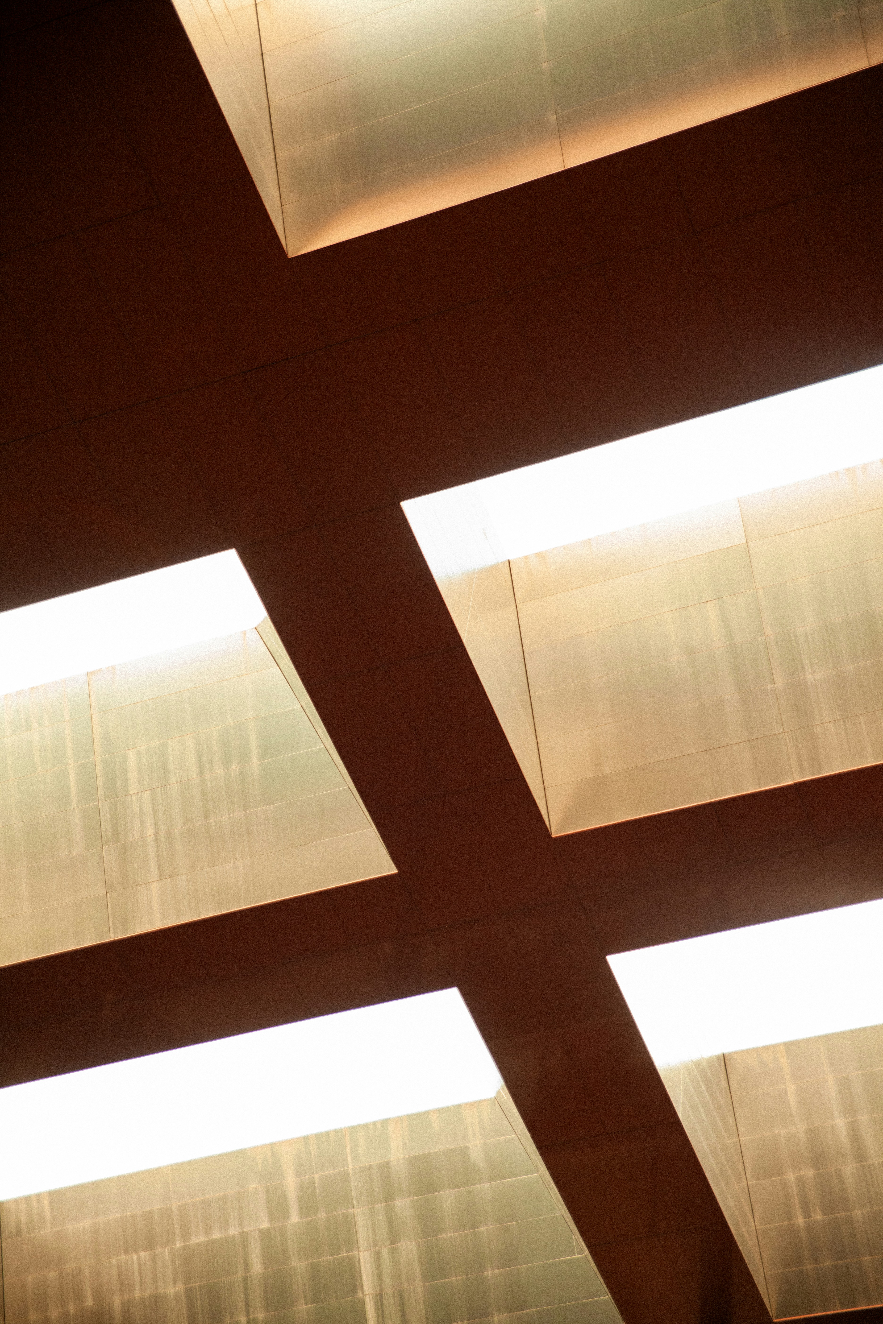 Angled Glass Vaults Through Abstract Architecture