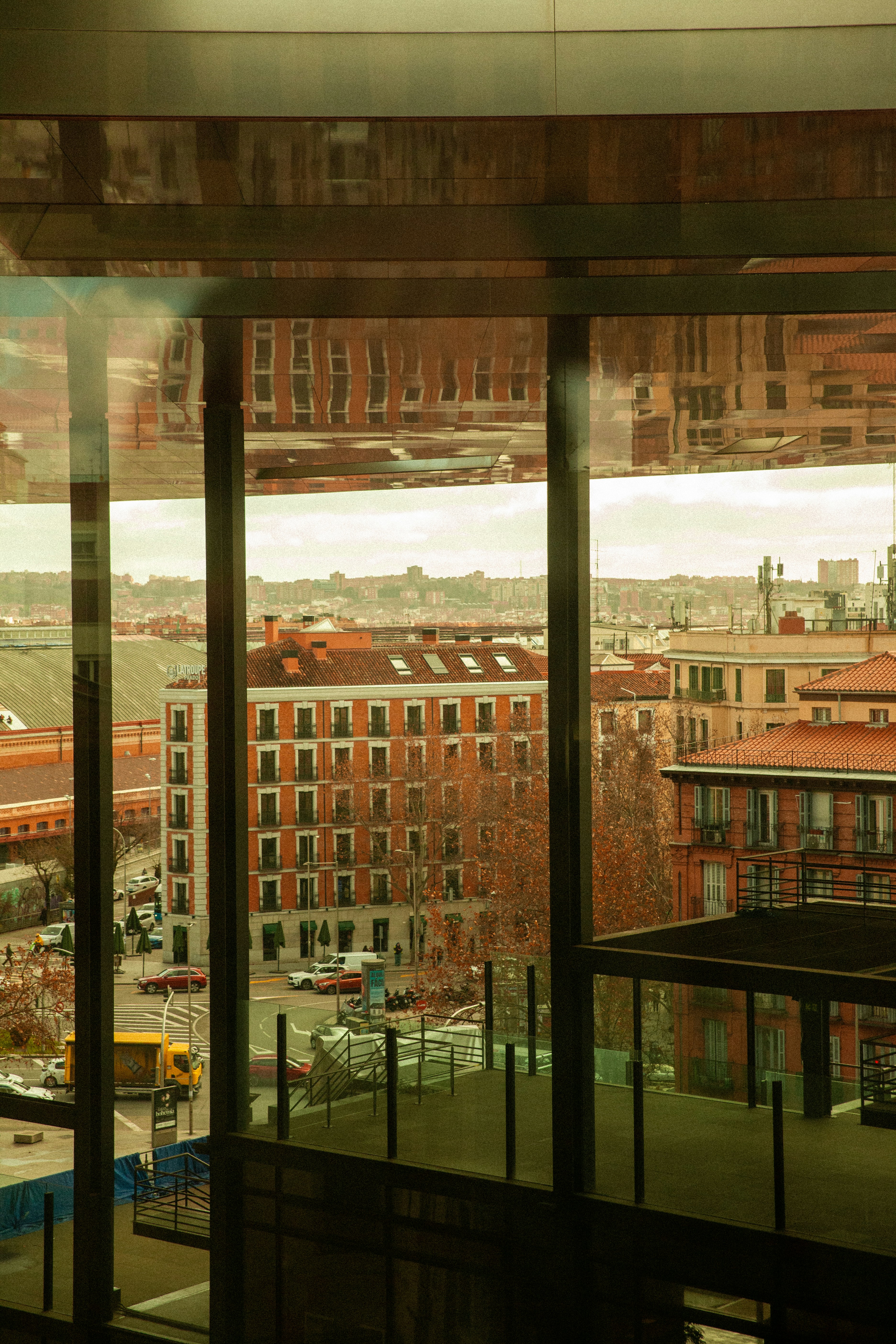 Reflections Overlooking a Brick-Patterned City