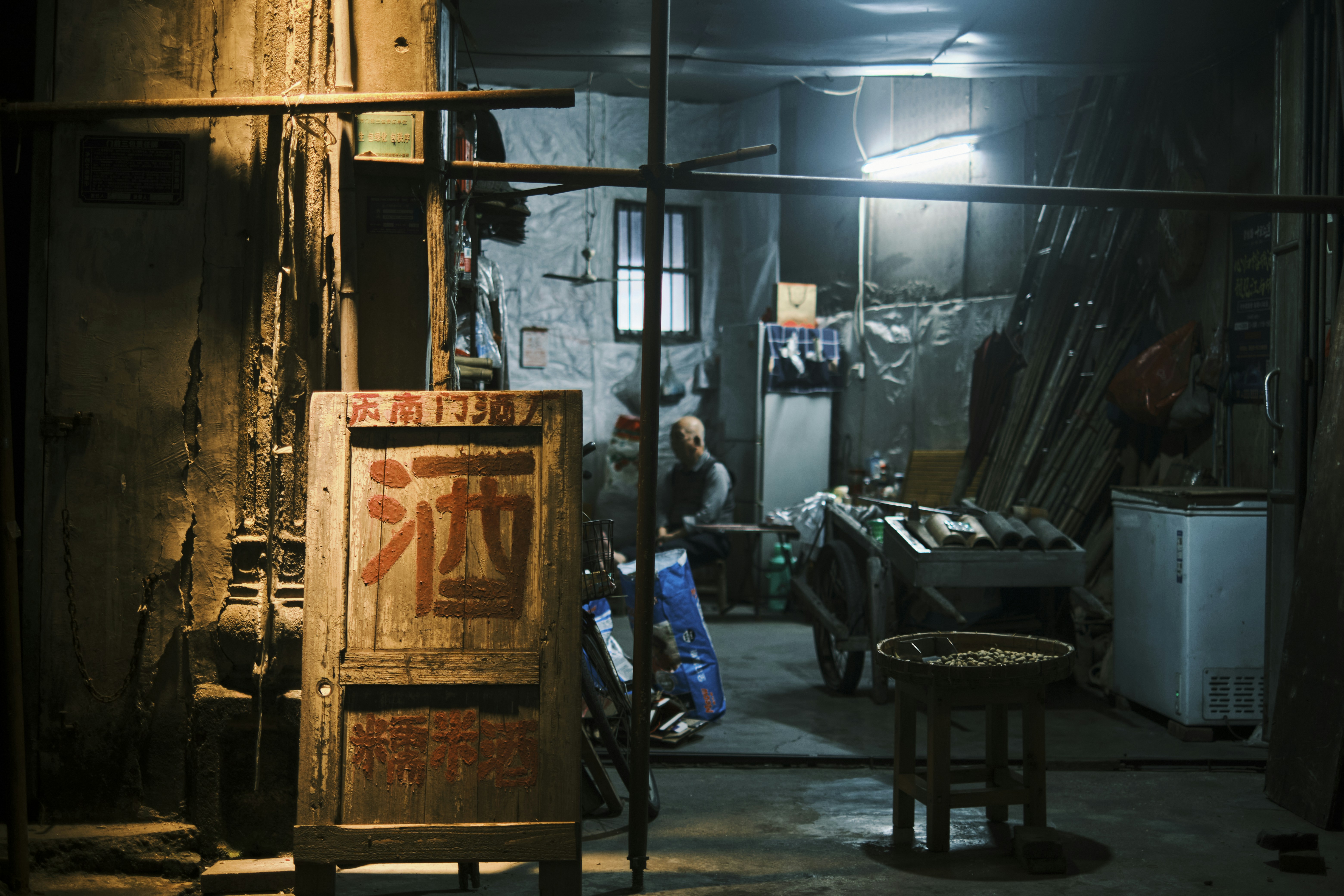 Dim Backroom Workshop: A Quiet Corner with Aged Signage