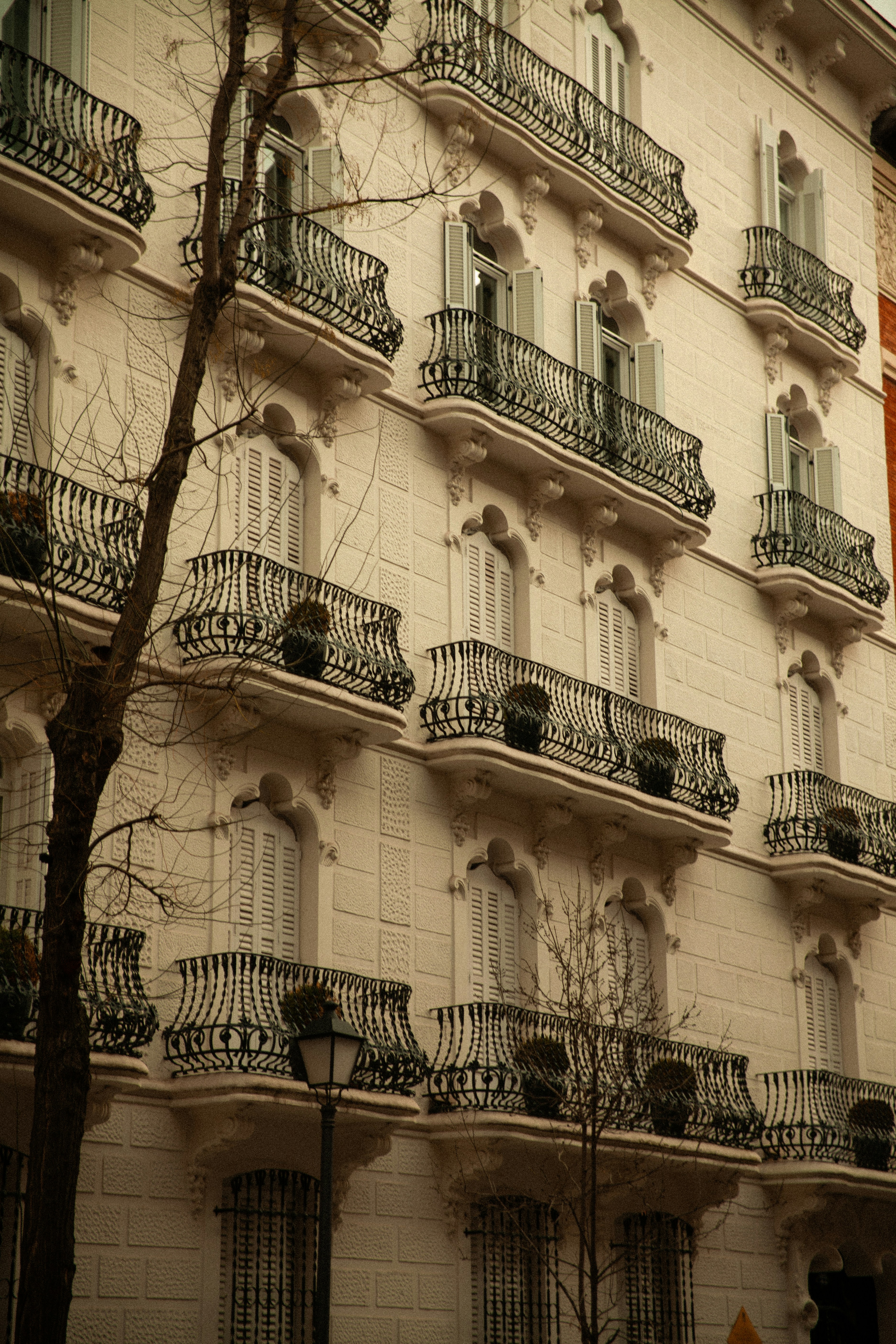 Ornate Facade: Repeating Balconies in Soft Autumn Light