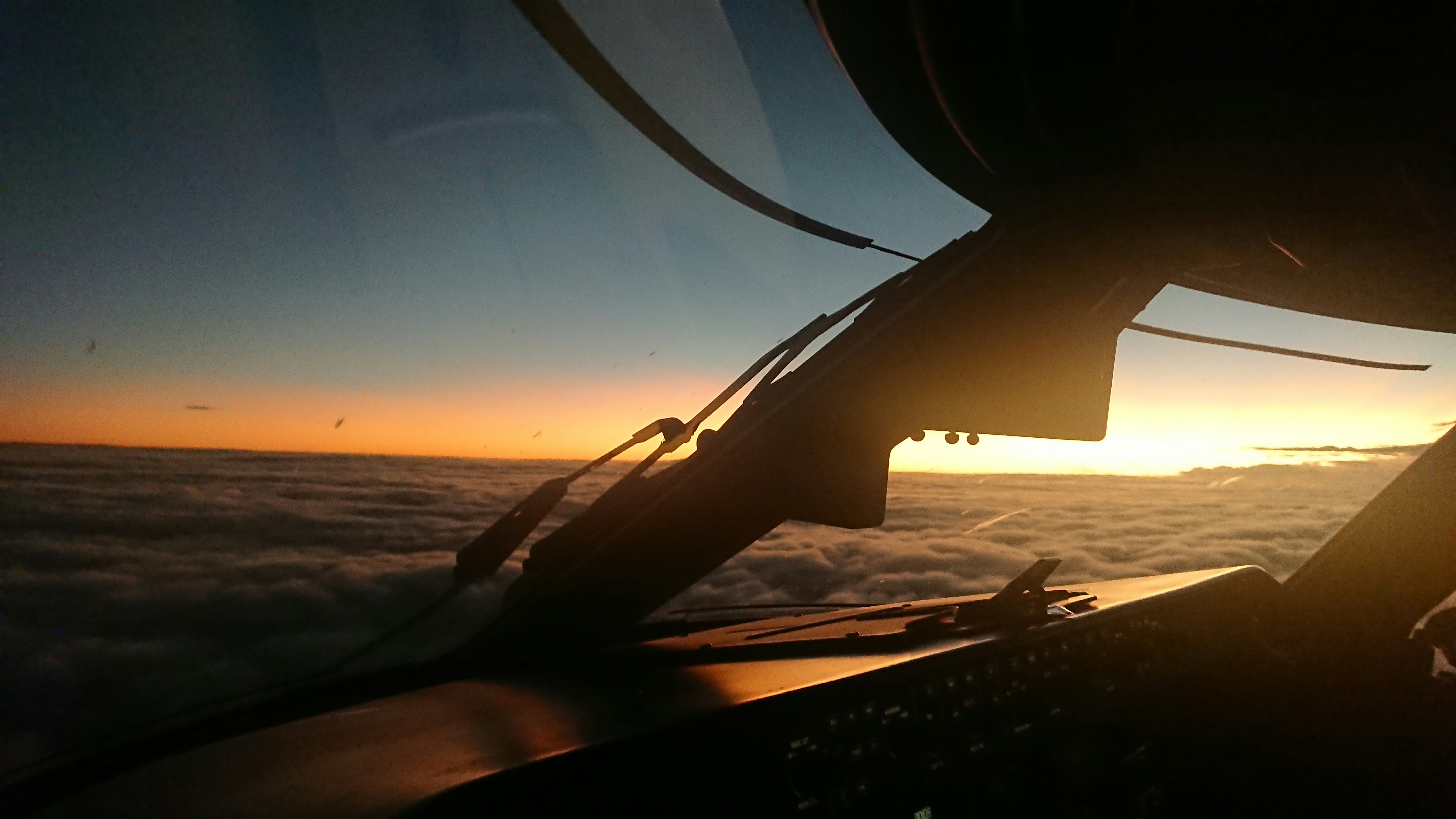 Dawn Cruise: Horizon Glint Beneath the Cockpit