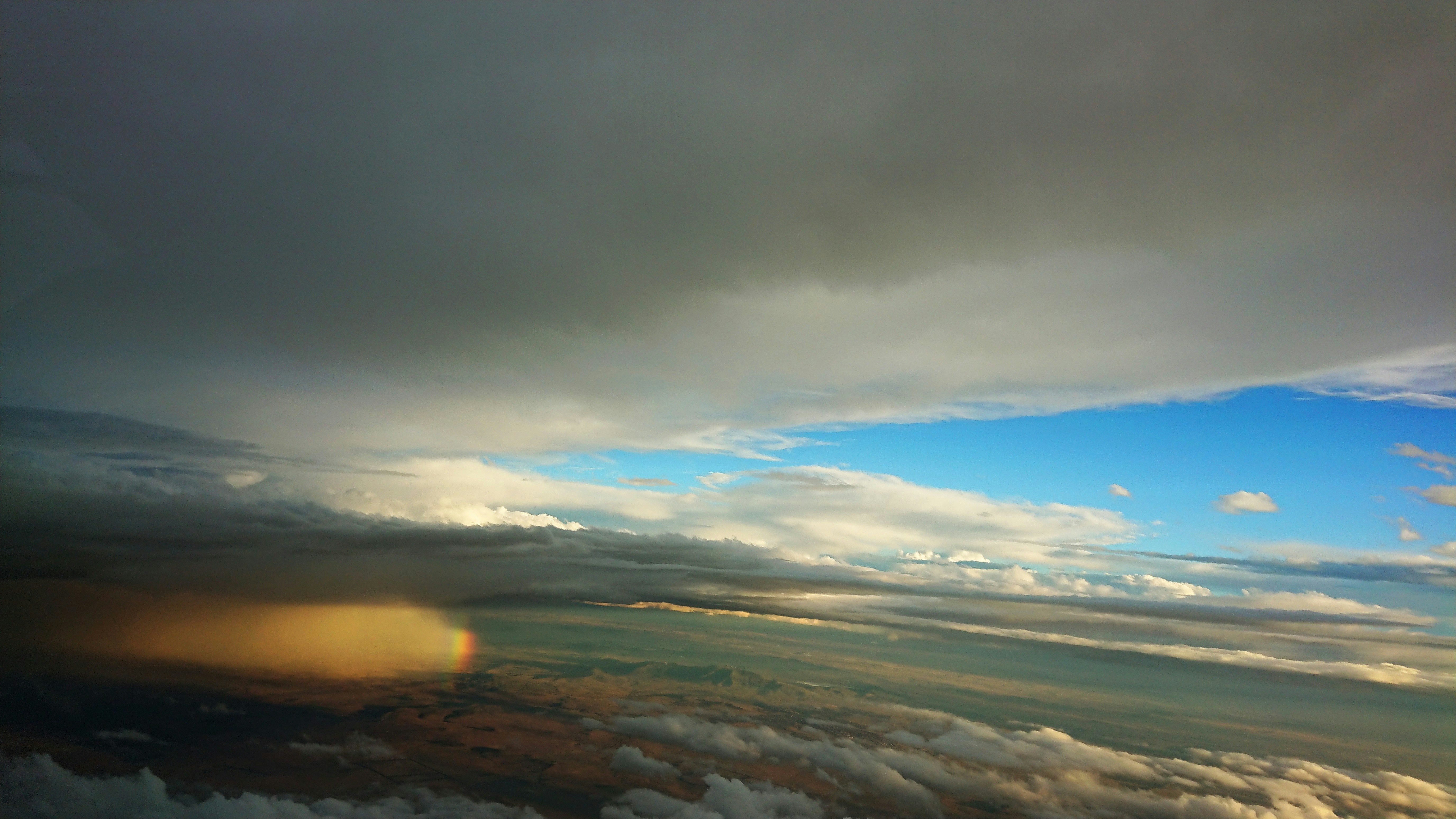 Dramatic Skyscape: Rift of Light Over Turbulent Clouds