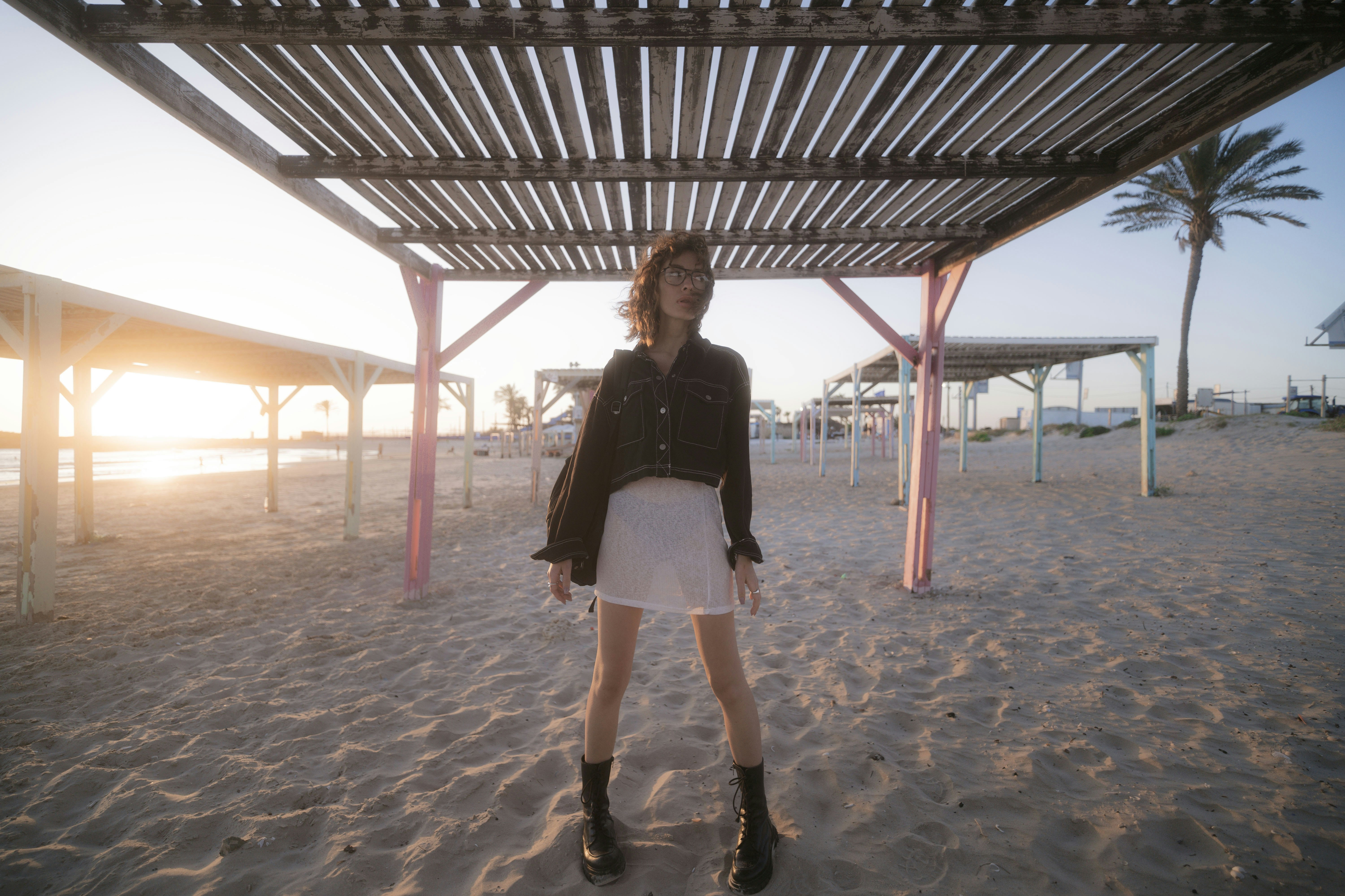 Under the Sunset Nets: A Confident Pose on the Beach