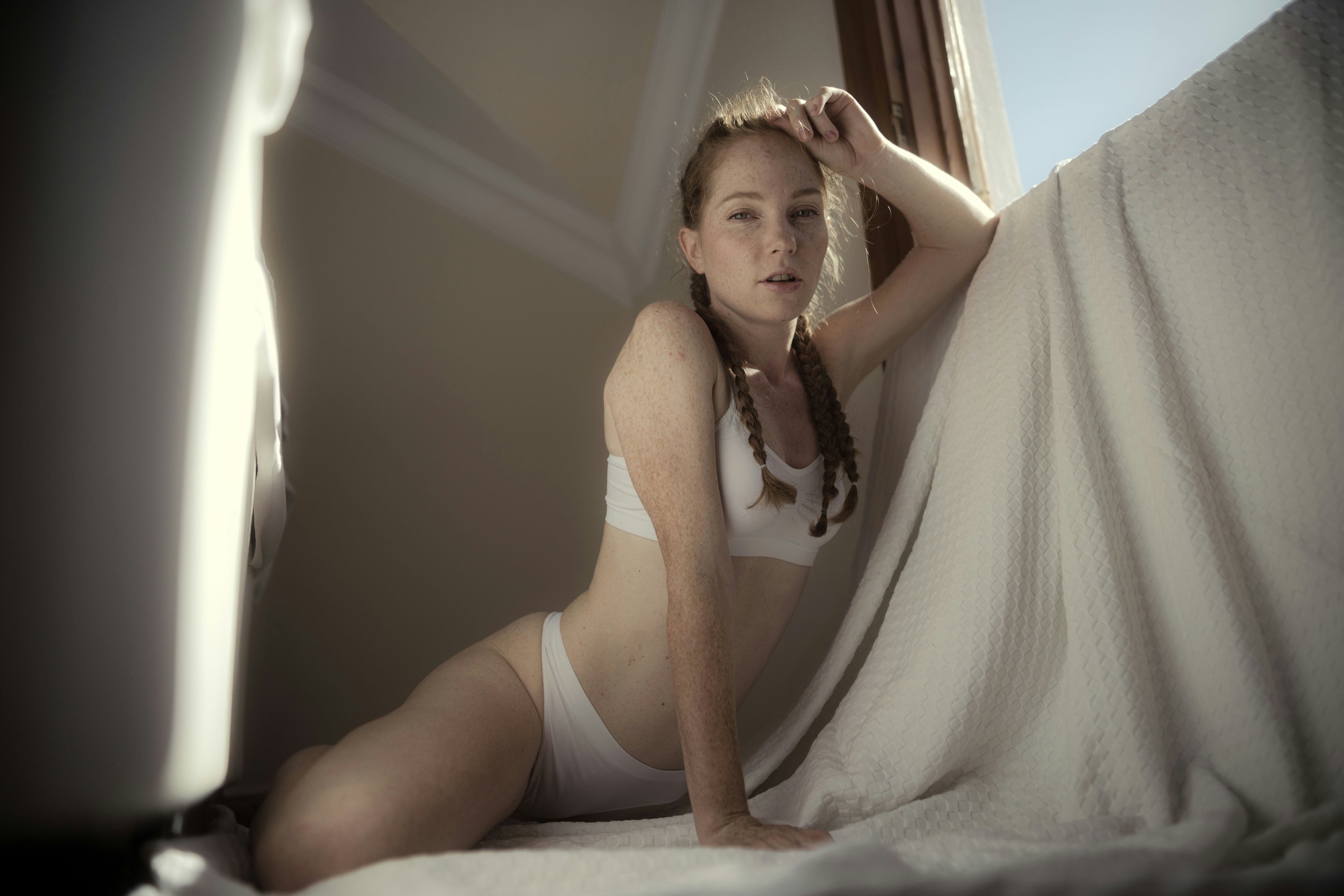 Soft Reach: Sunlit Pose in a Pillow Fortress