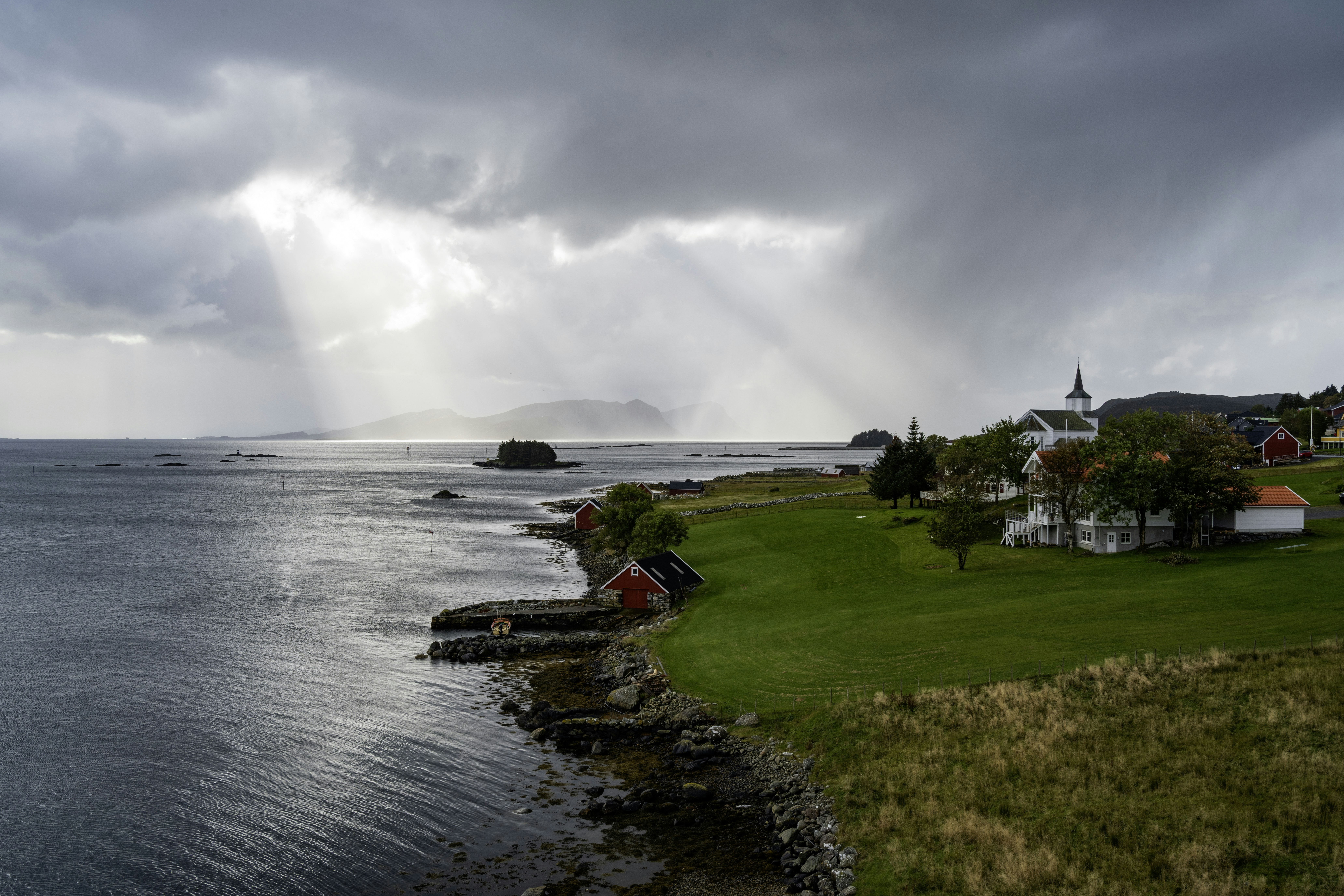 Coastal Village Bathes in Beams of Sunlight