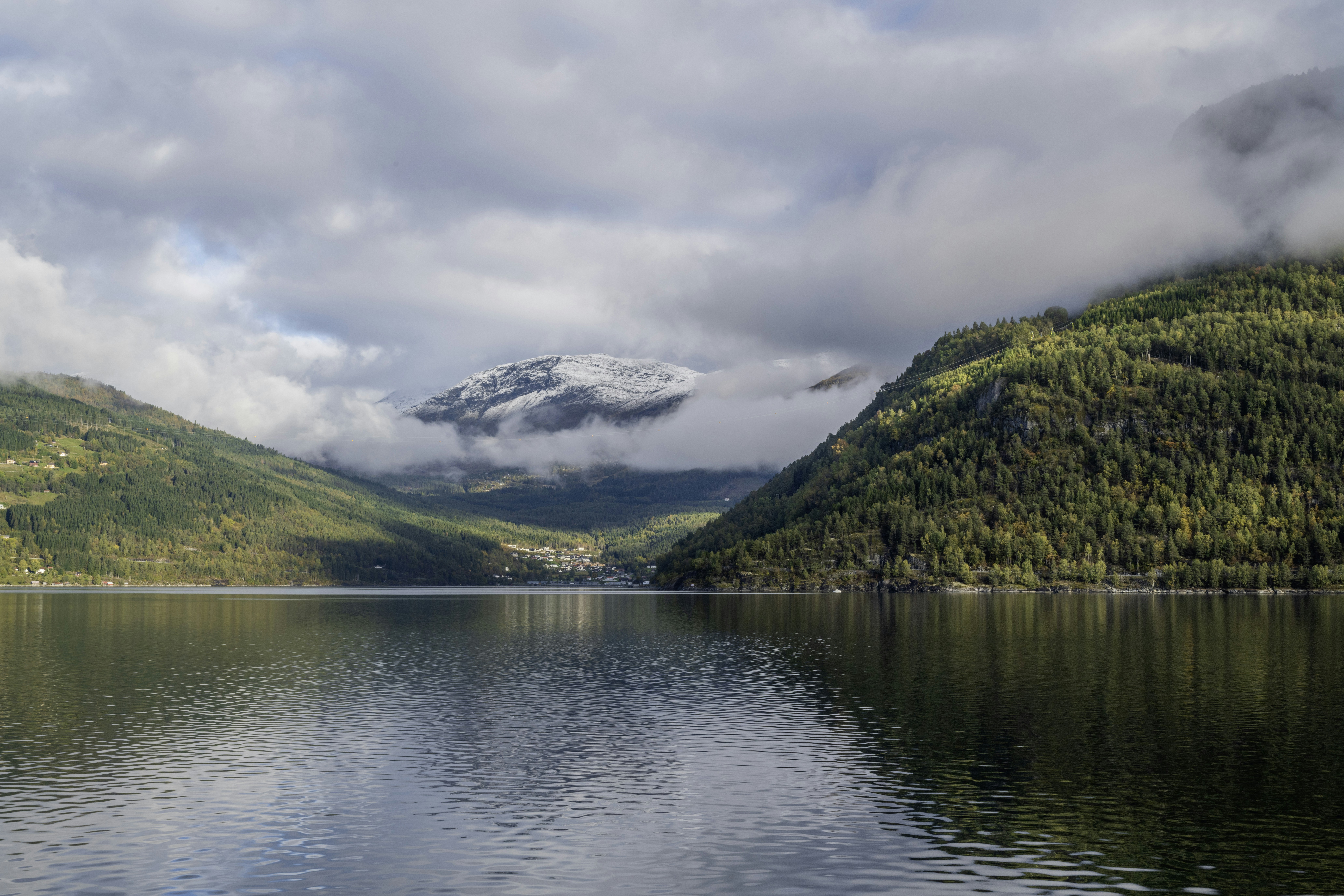 Mirror of the Valley: Snowcap and Pine Ridge Across Still Waters