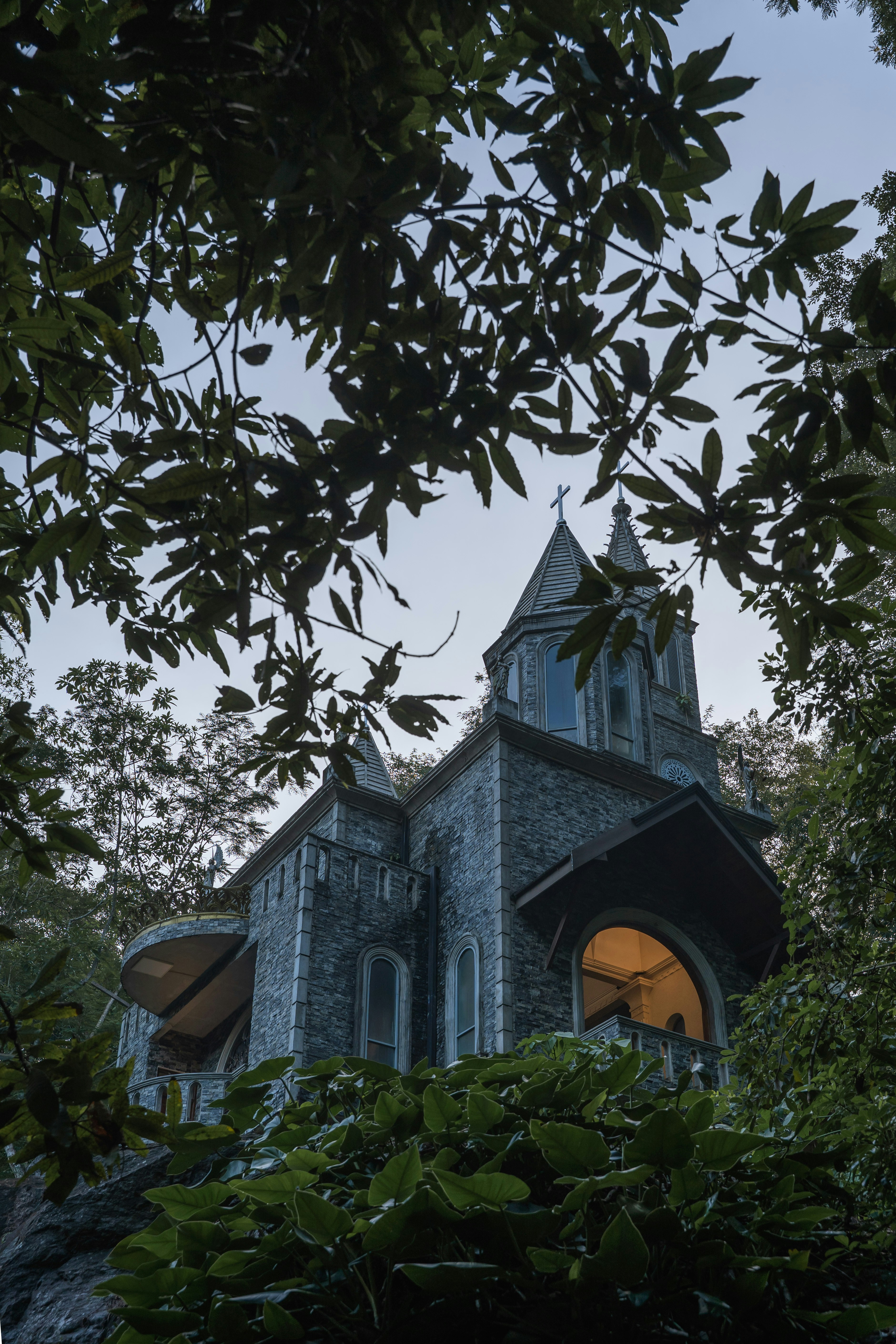 Gothic Chapel Rising Through Encroaching Foliage