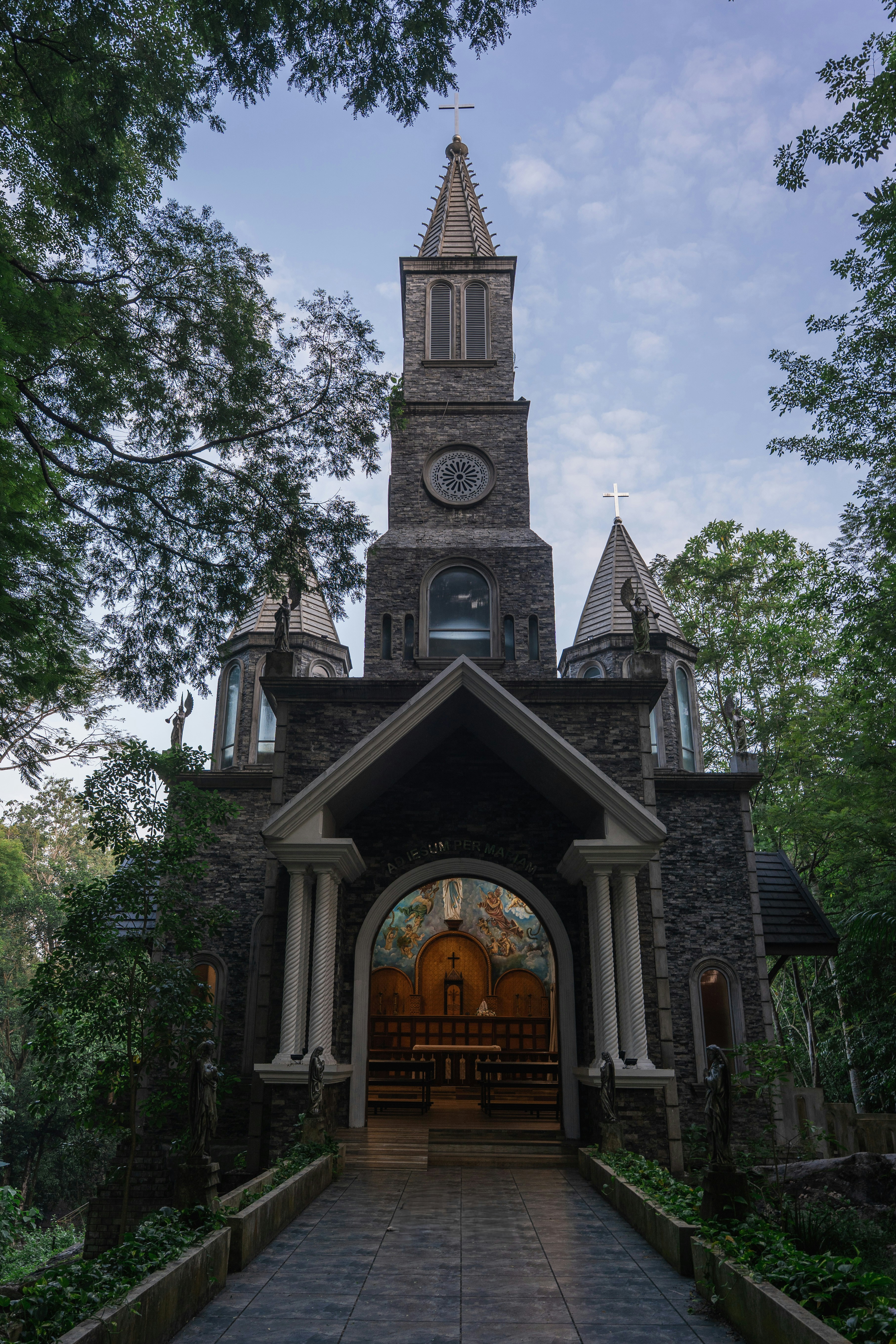 Chapel in the Woods: A Central Church Tower Framed by Dawn Light