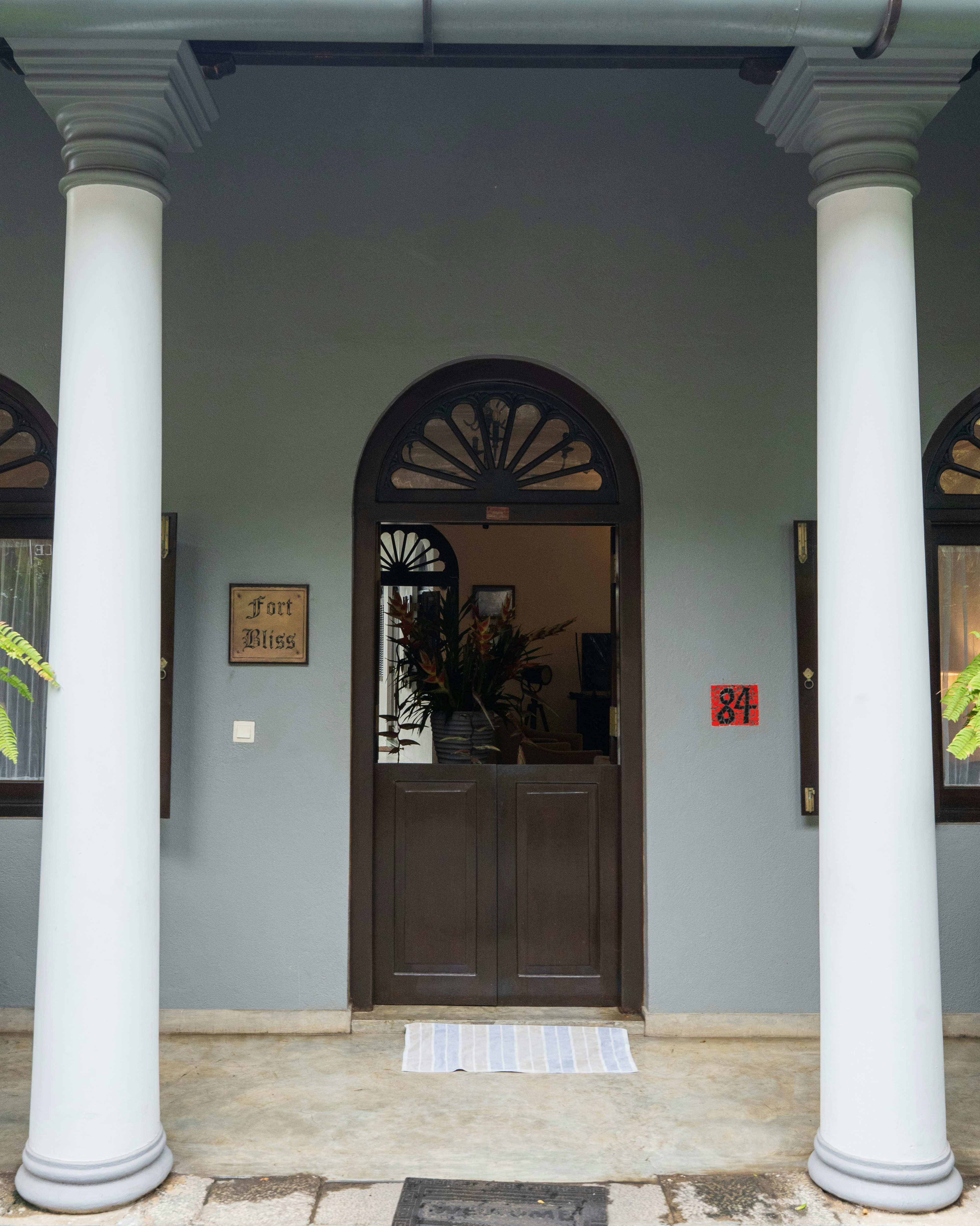 Arched Entrance with Symmetrical Columns and a Subtle Indoor Glow