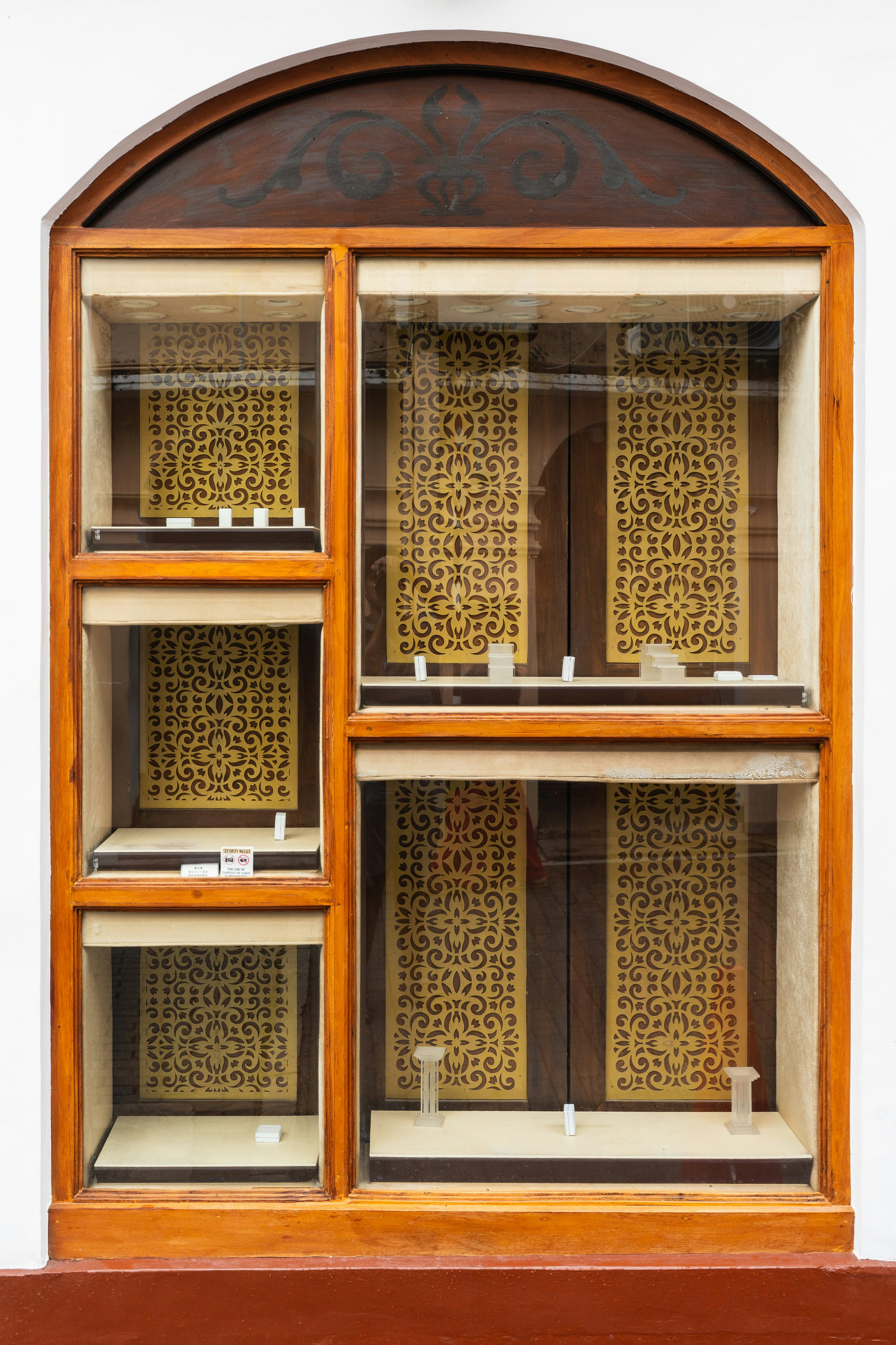 Ornate Window Symphony: A Wooden Frame with patterned glass Panels