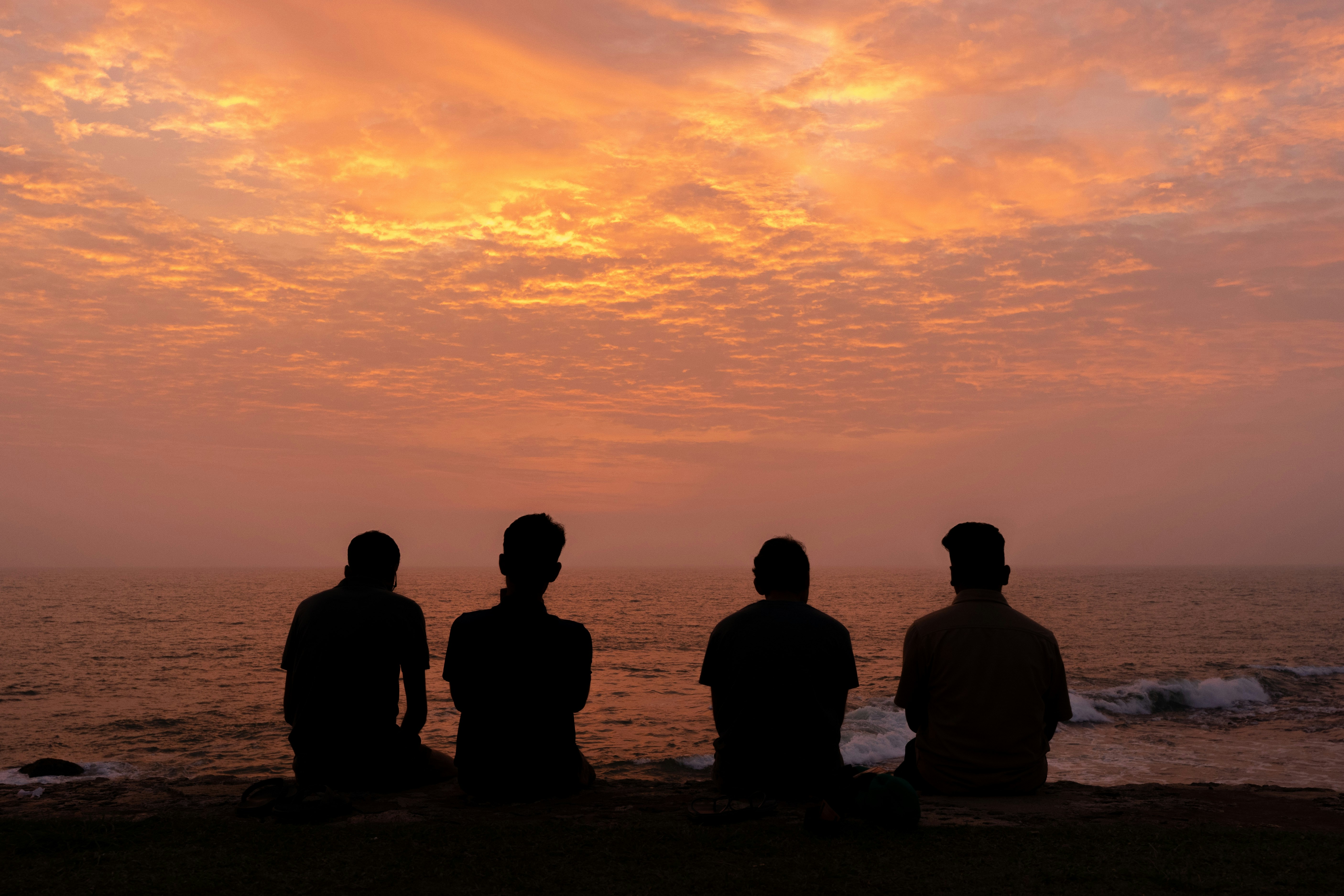 Sunset Silhouette Quartet on the Shoreline