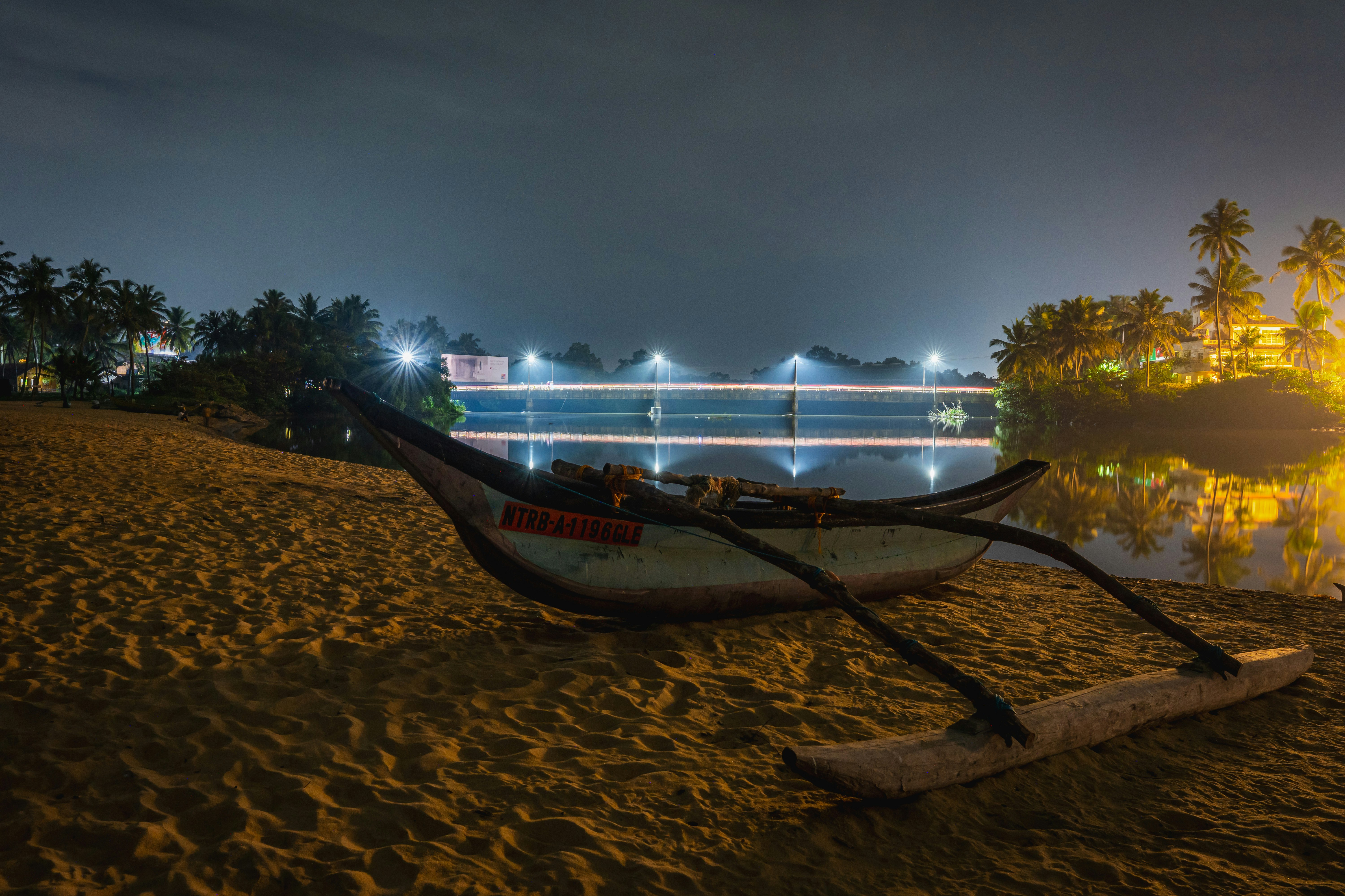 Moonlit Boat on a Velvet Beach Under Neon Night