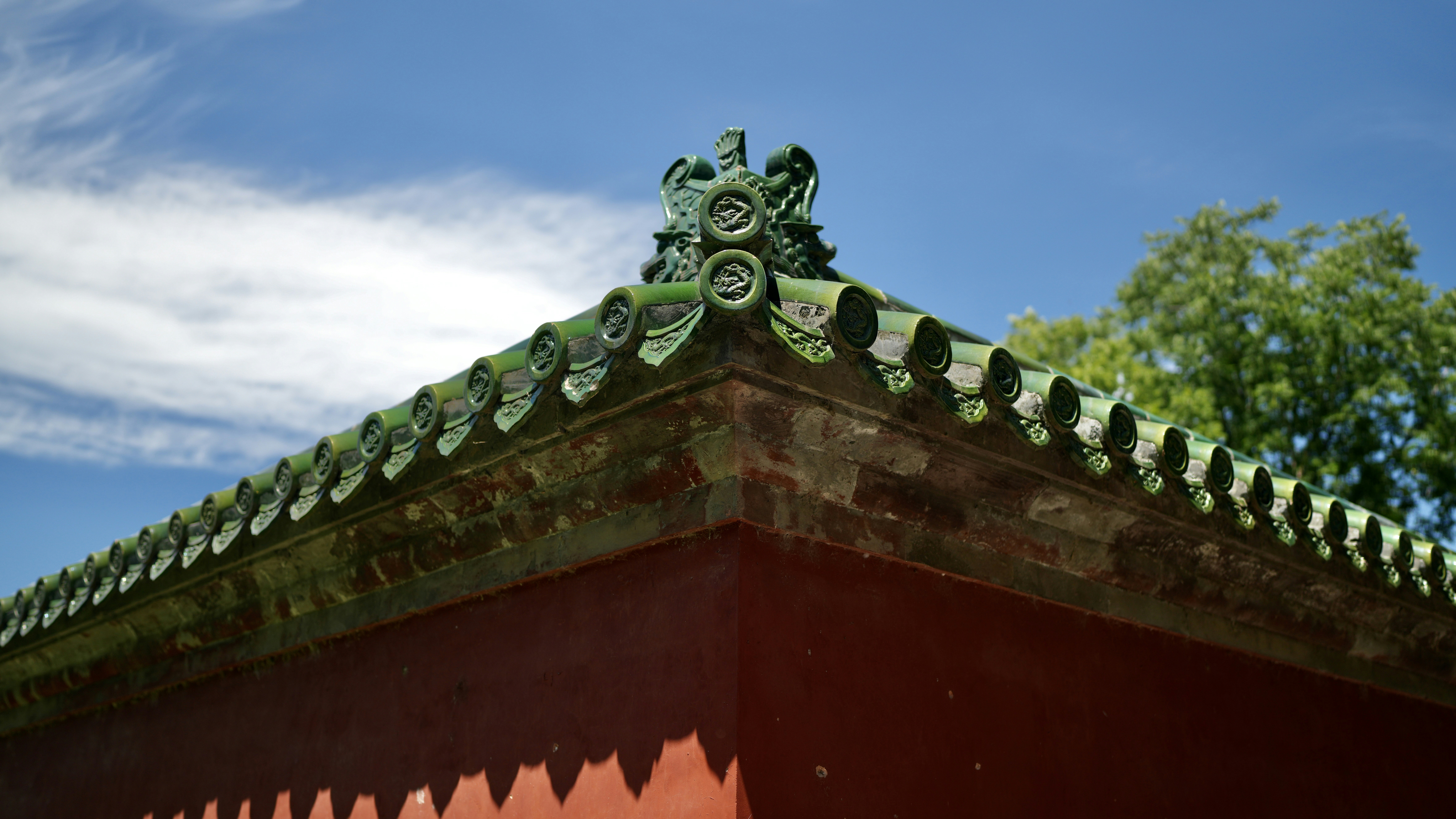 Green Tile Crest Over Red Eaves