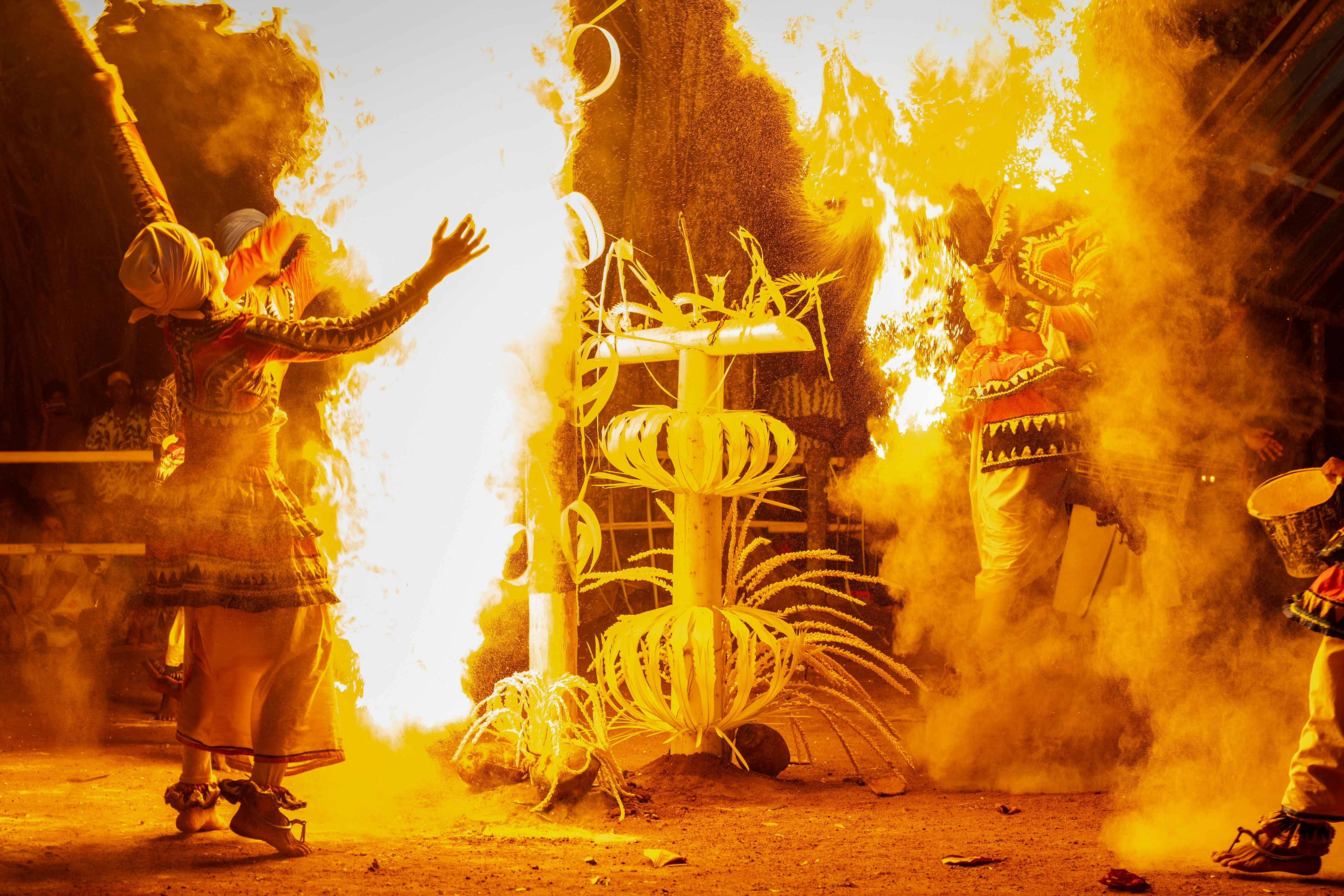 Inferno Stage: Fire Dancers Enshrouded in Orange Flame